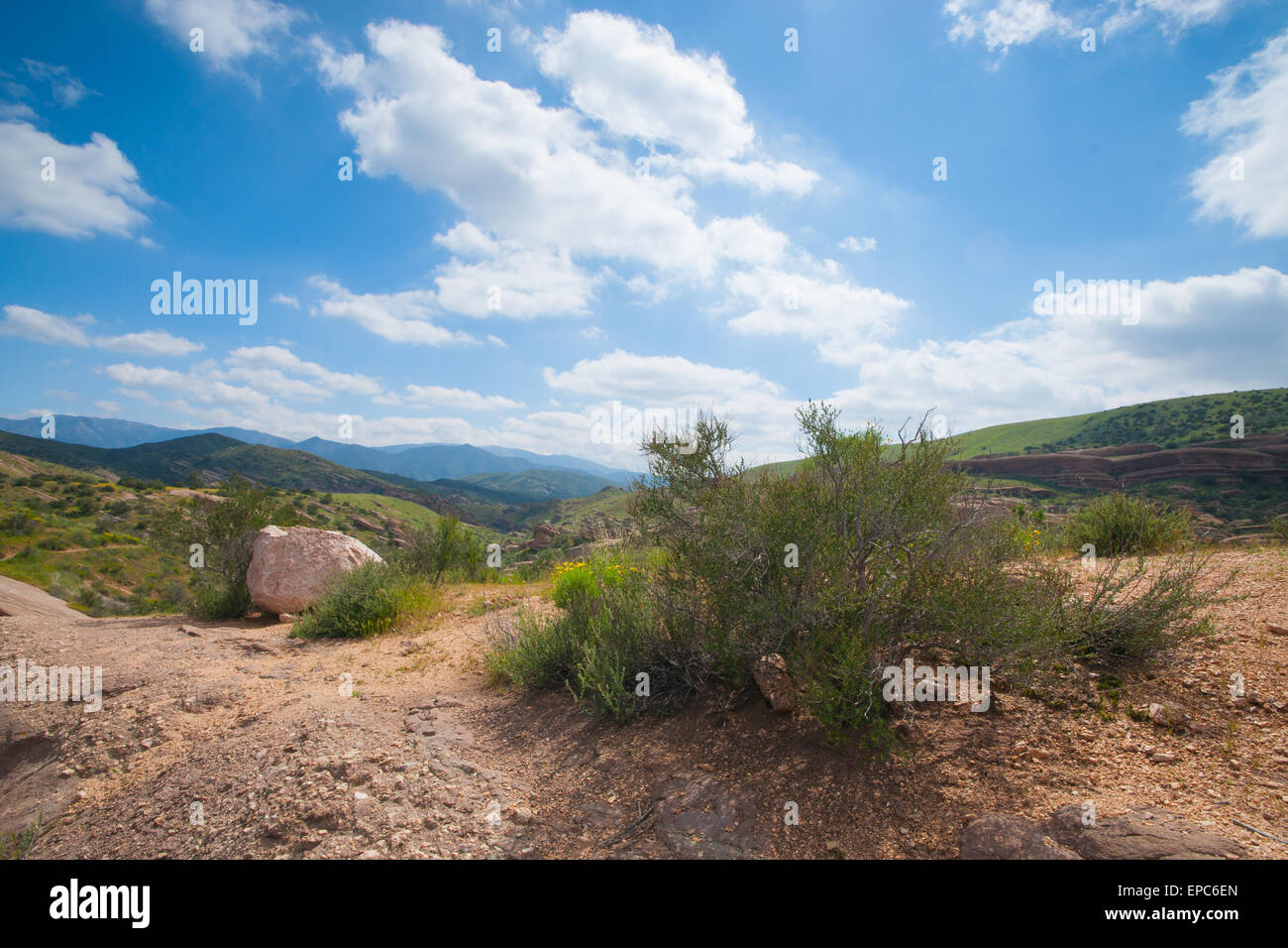 Scrub brush rocks and boulders in the wilderness of California's Mojave ...