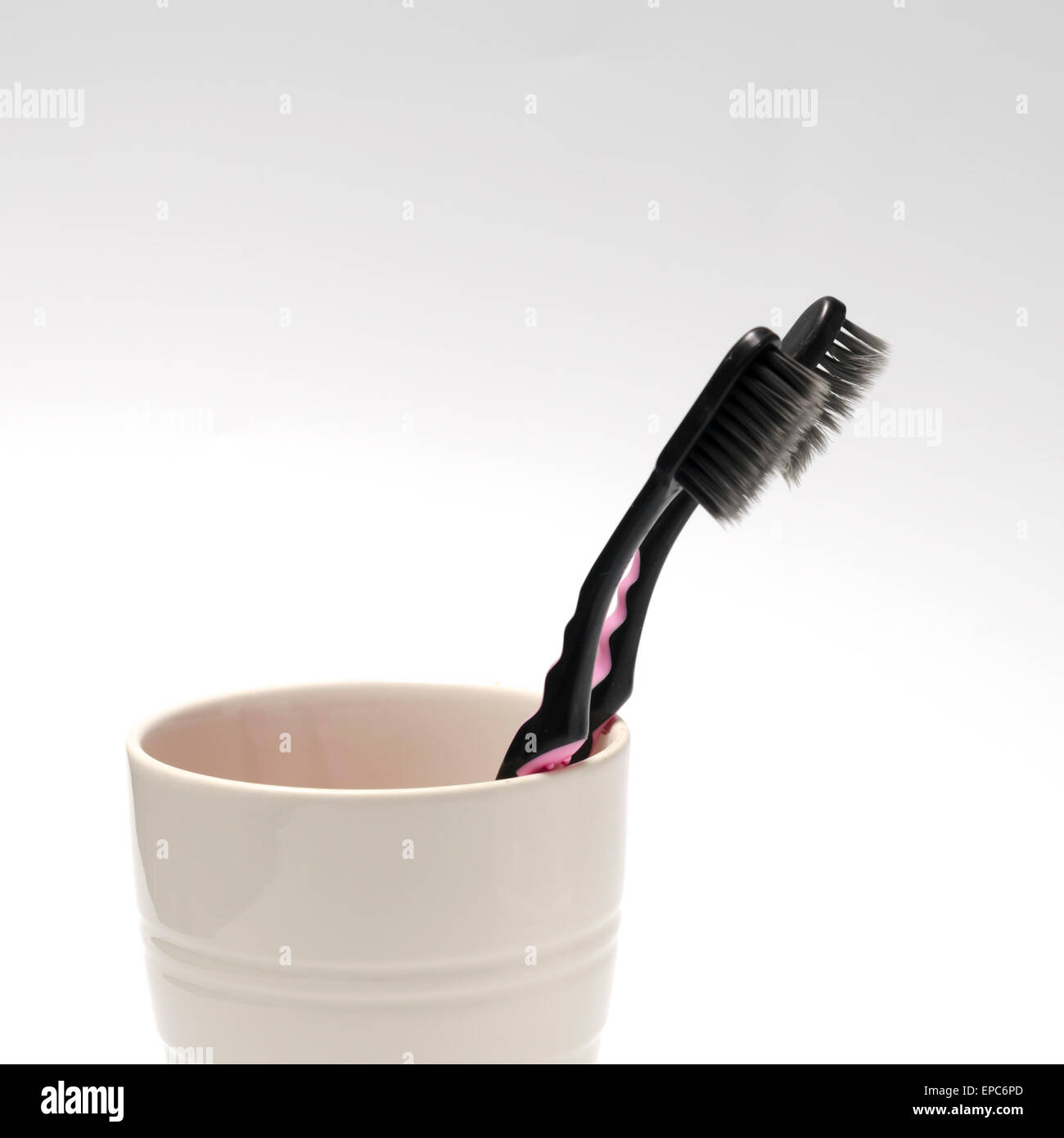 Tooth brushes in glass cup hi-res stock photography and images - Alamy