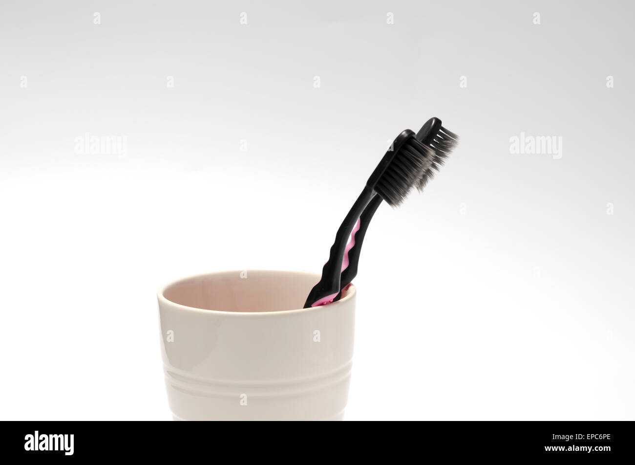 tooth brush in glass on a white background Stock Photo - Alamy
