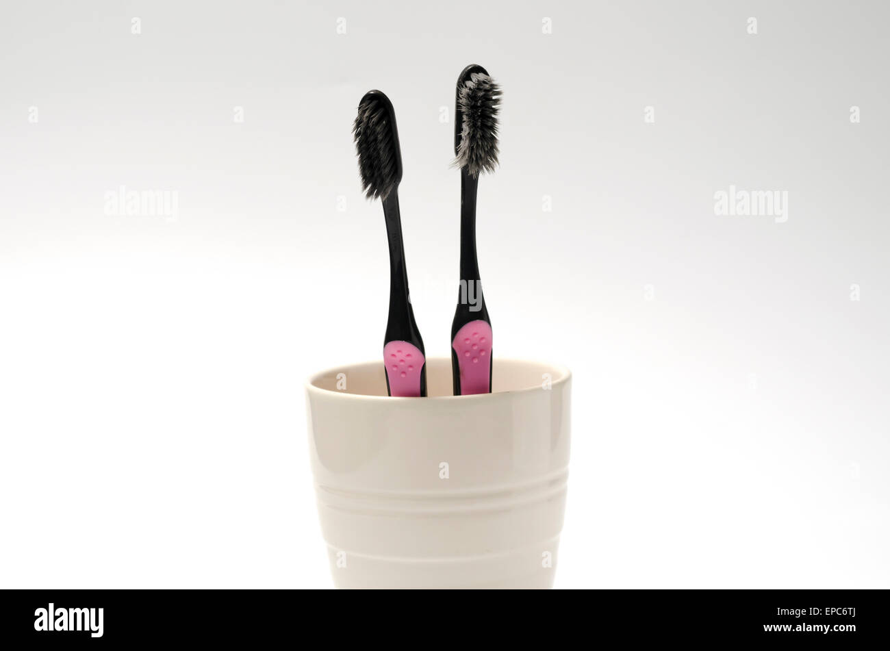 tooth brush in glass on a white background Stock Photo - Alamy