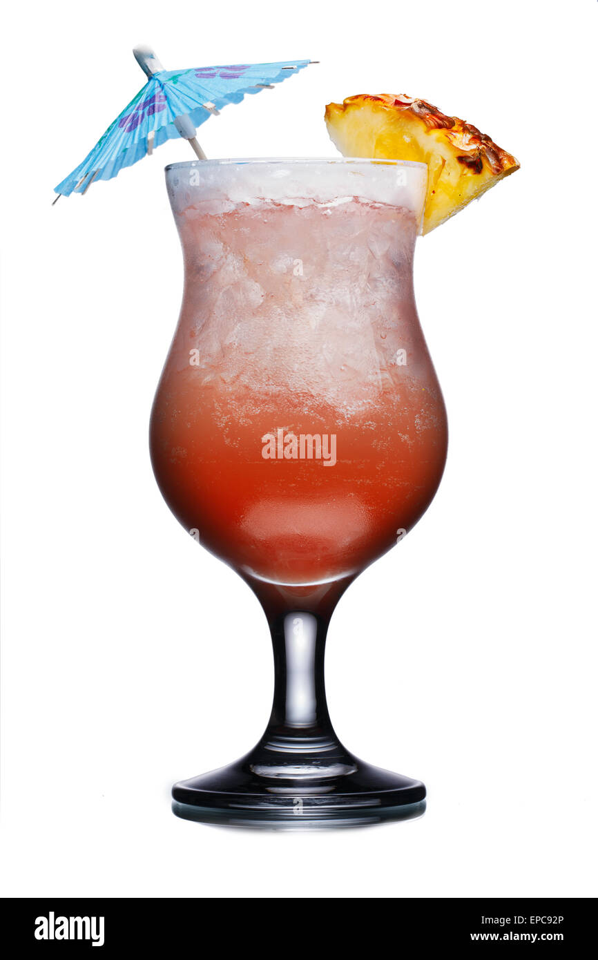 Alcoholic cocktail in hurricane glass decorated with umbrella and ...