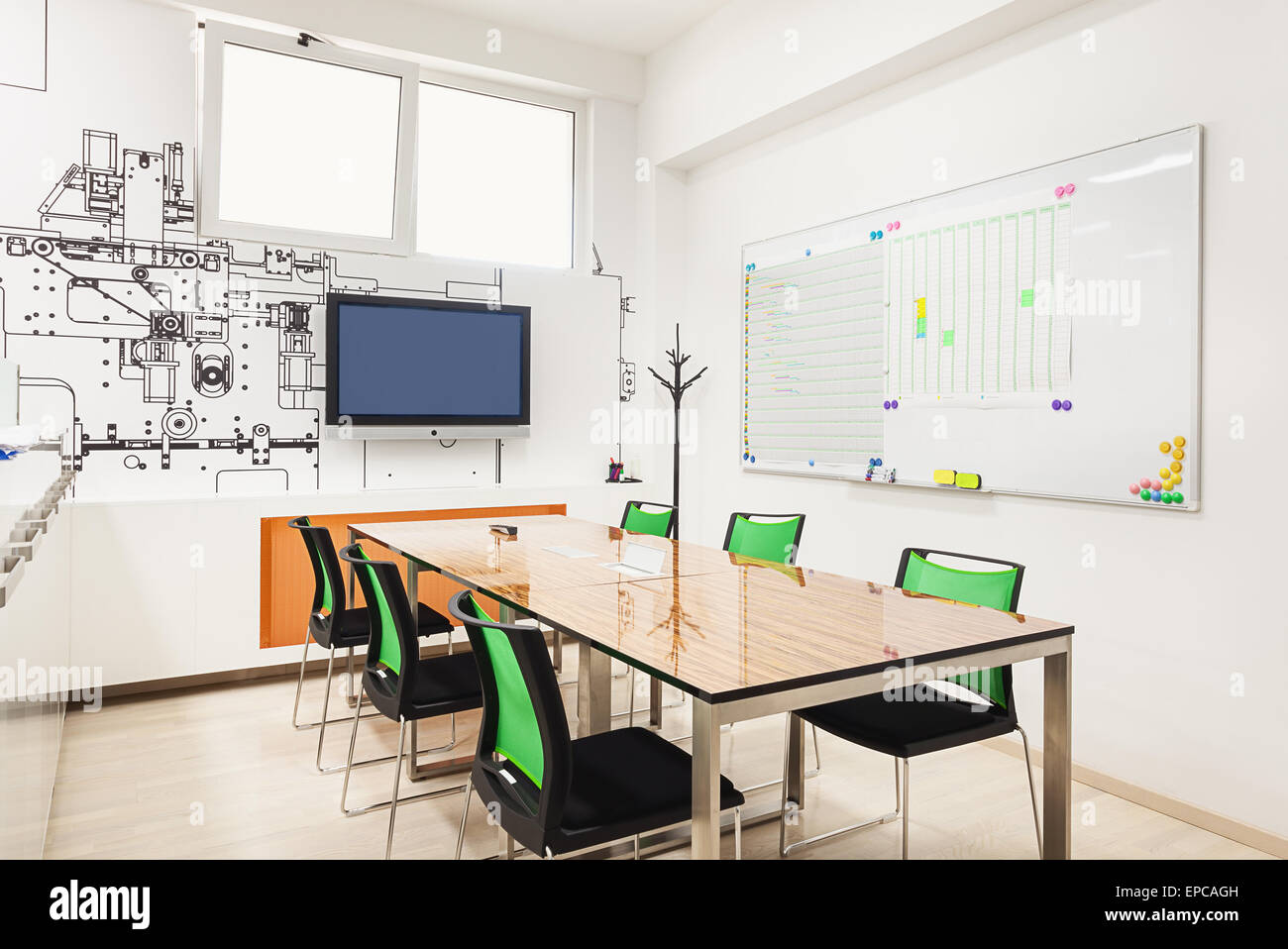 Office interior in white with printed wallpapers presenting part of a ...