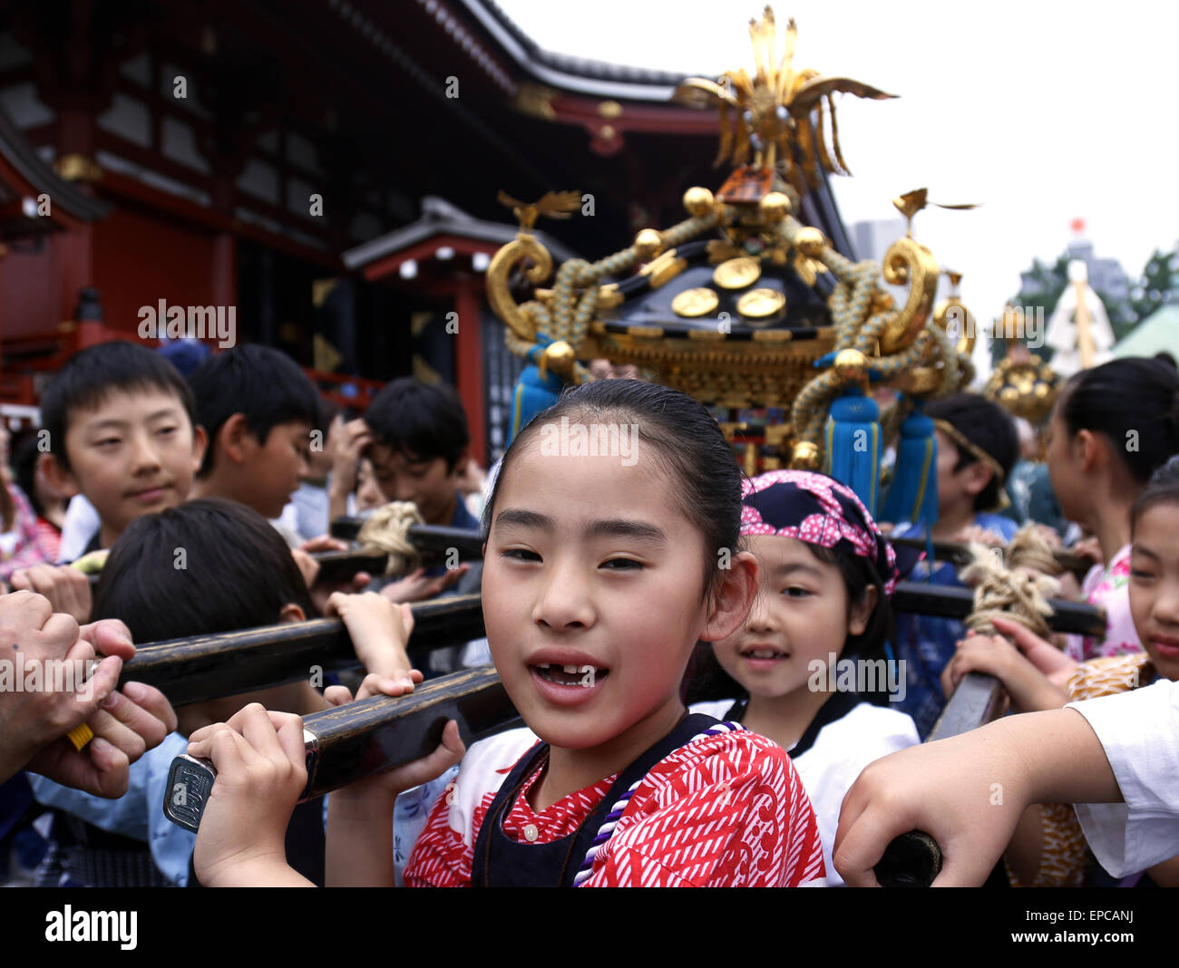 Tokyo, Japan. 16th May, 2015. Children carry a portable shrine during ...