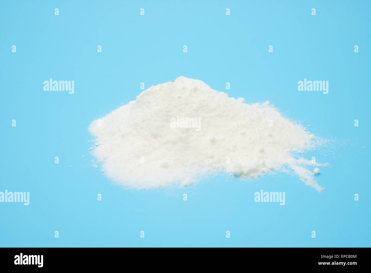 powdered milk on blue background Stock Photo - Alamy