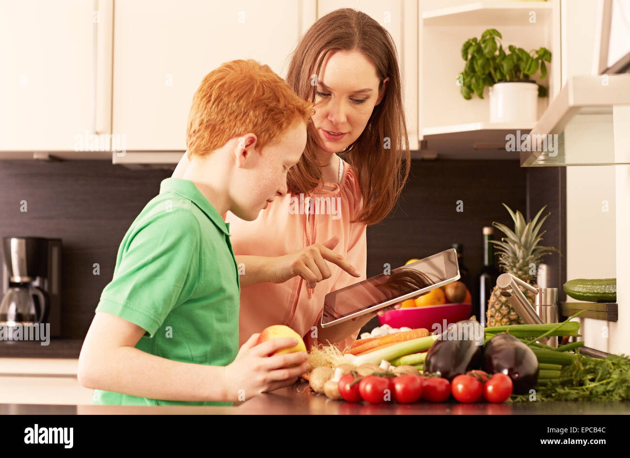 mother and child in the kitchen Stock Photo - Alamy