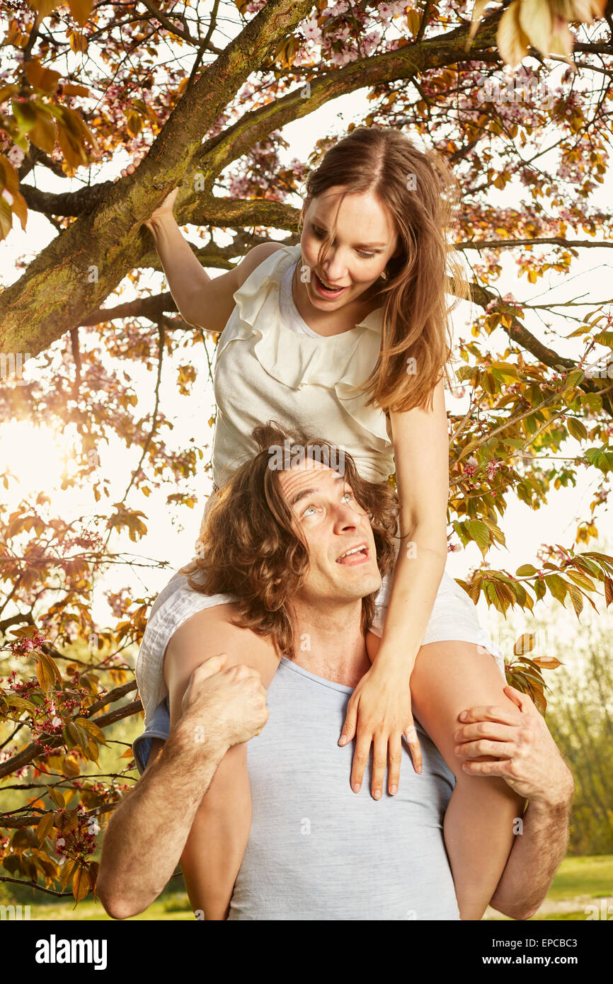 Love under the tree hi-res stock photography and images - Alamy