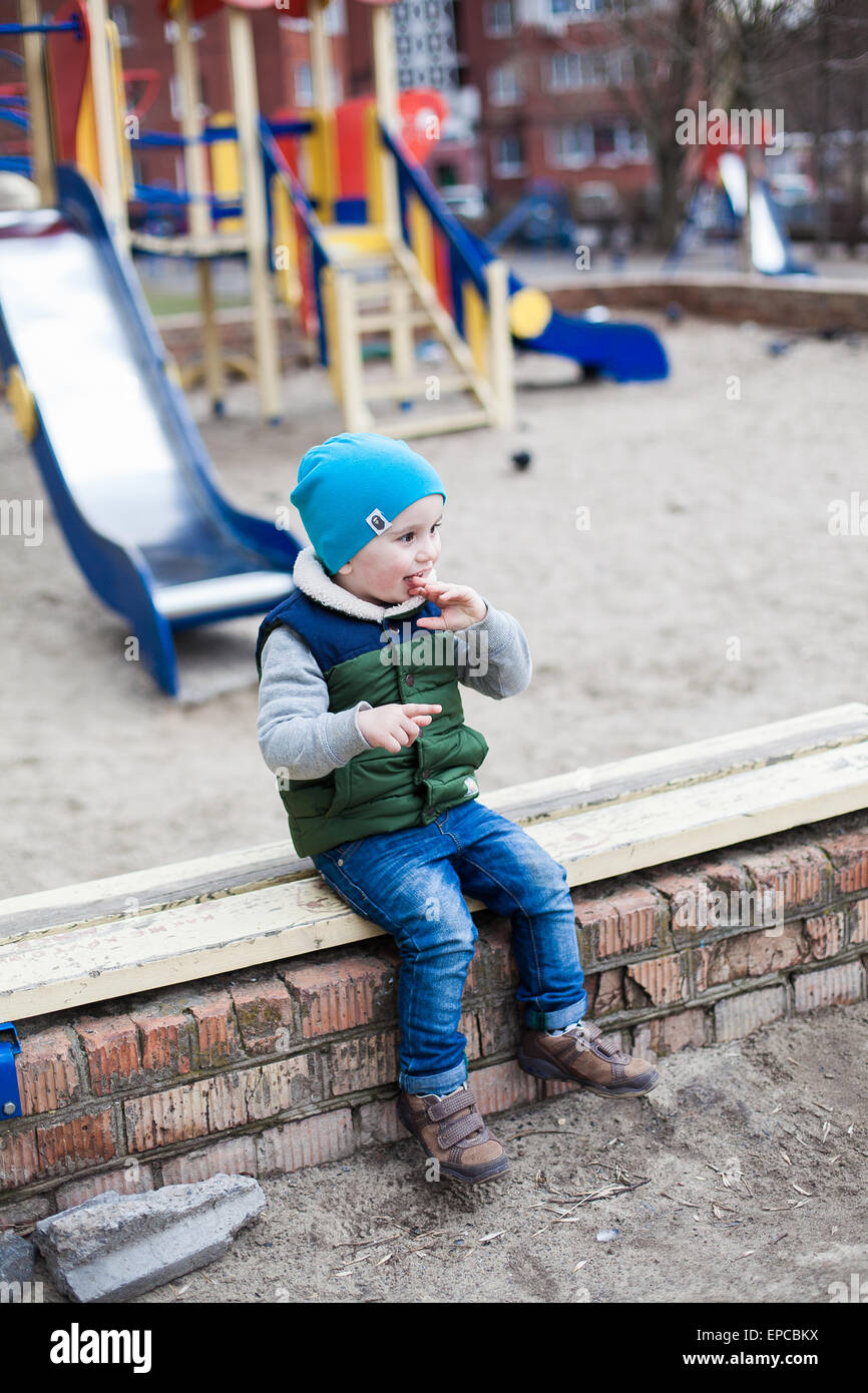 Little boy on playground Stock Photo - Alamy