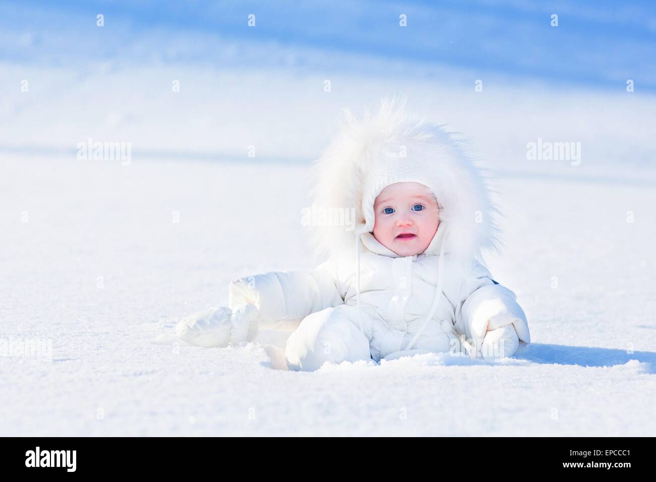 Baby in snow Stock Photo - Alamy