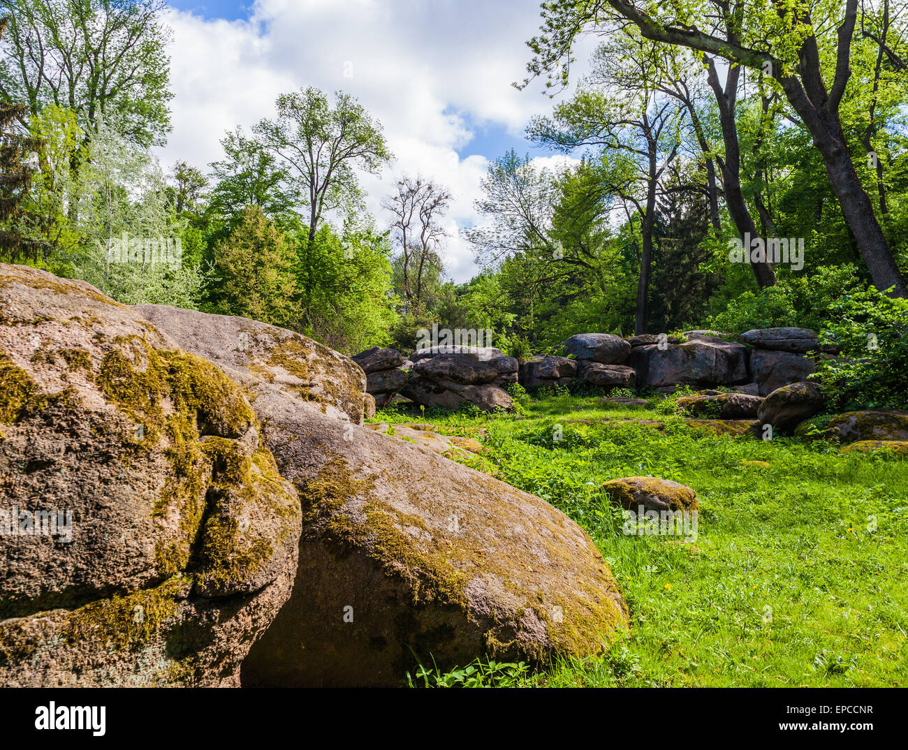 landscape, large rocky boulders and green trees Stock Photo - Alamy