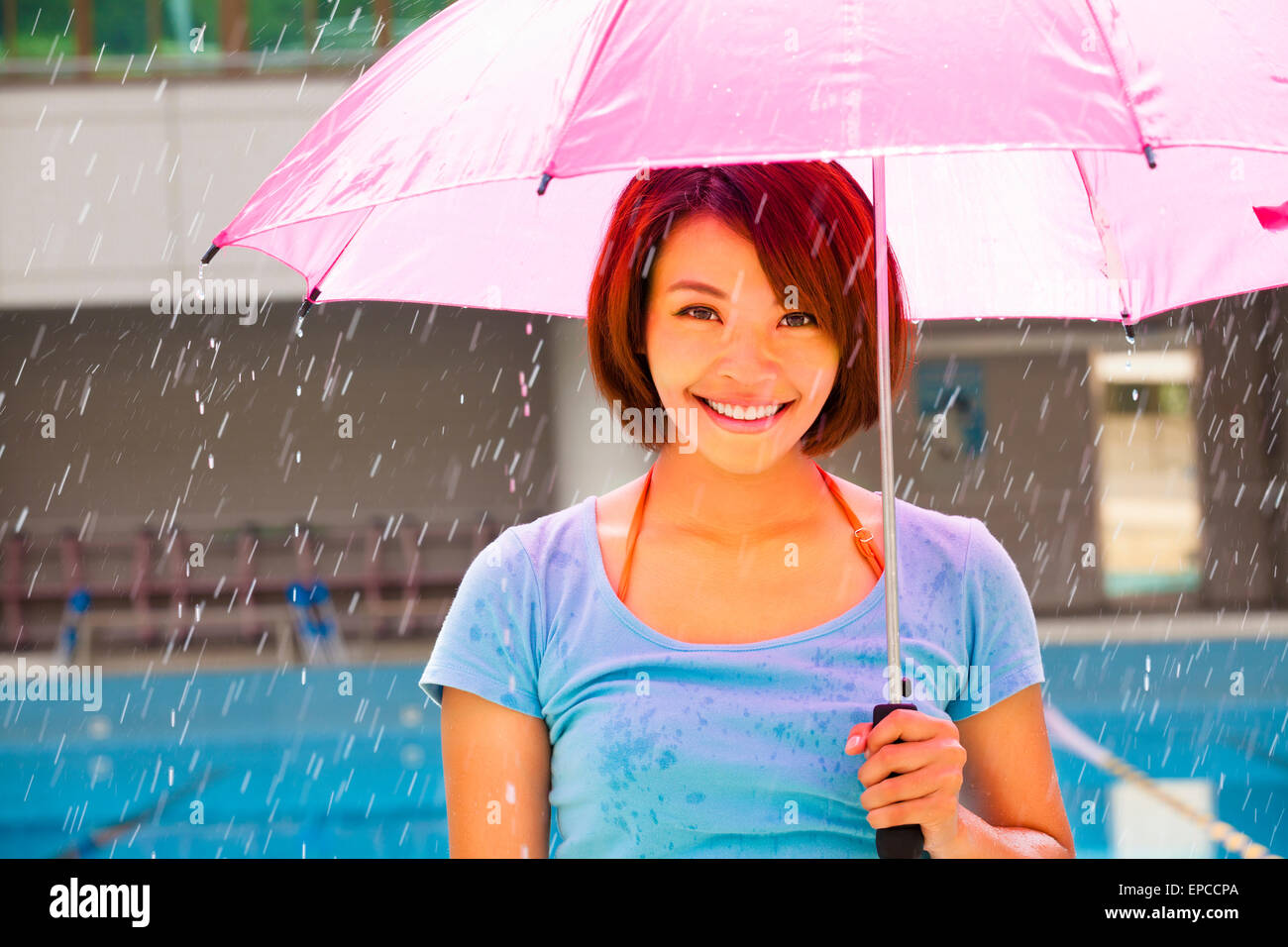Beautiful woman under umbrella hi-res stock photography and images - Alamy