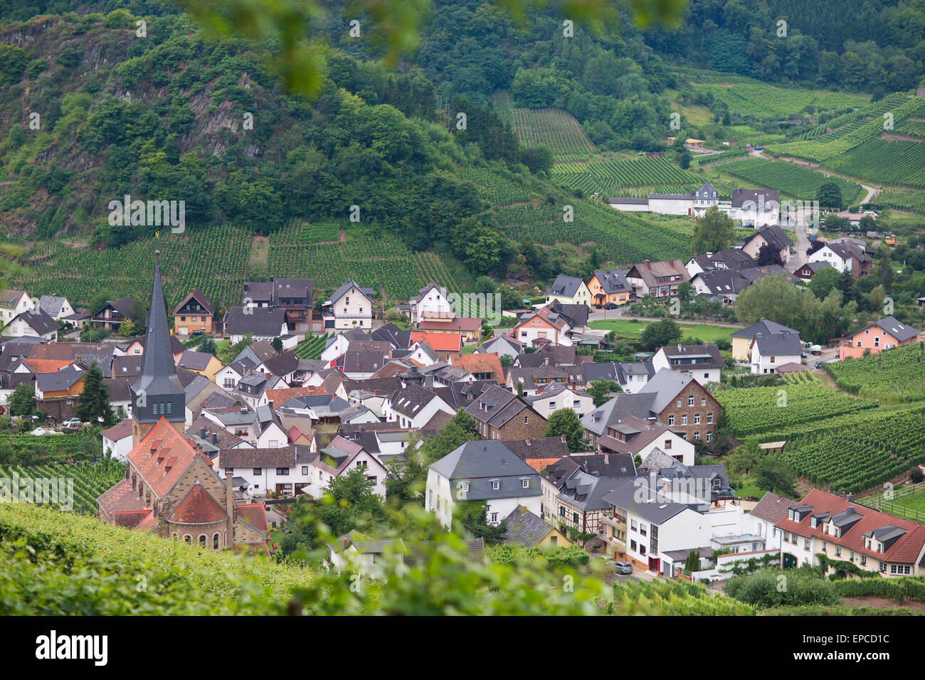 View of a beautiful village with mountains and vineyards in Germany ...