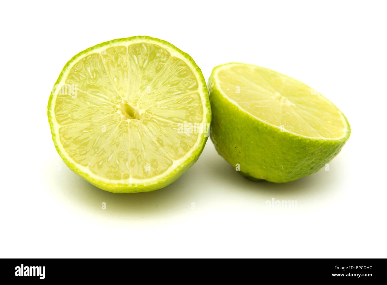 fresh green cut lime fruit isolated on white background Stock Photo - Alamy