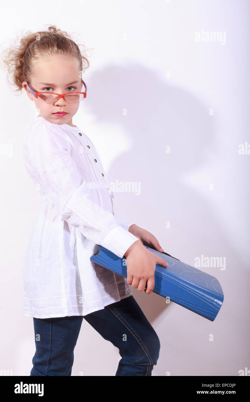 Basic school child with heavy file in the hand Stock Photo - Alamy