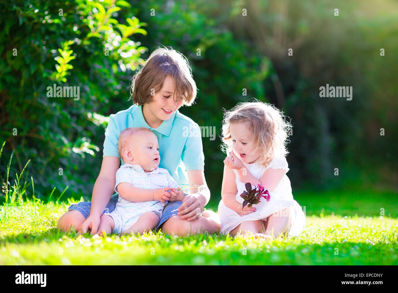 Three happy kids, brothers and sister, laughing teenager boy, little ...