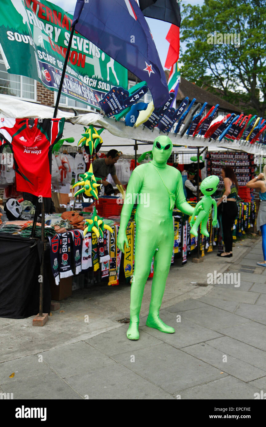 London, UK. 16th May 2015. Man dressed as an alien selling merchandise ...