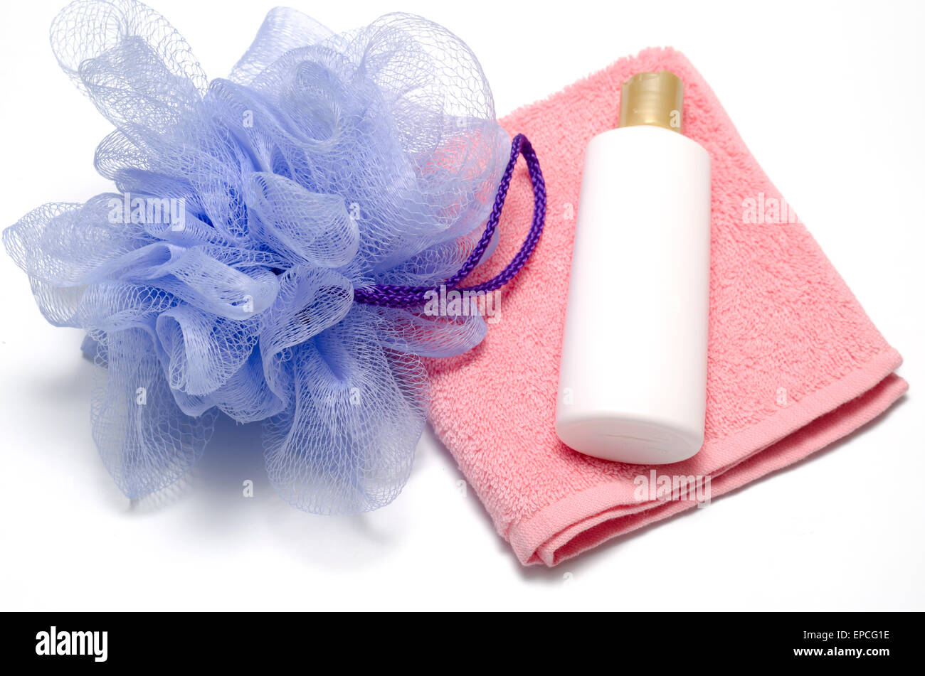 purple bath puff liquid soap and pink towel on a white background Stock ...