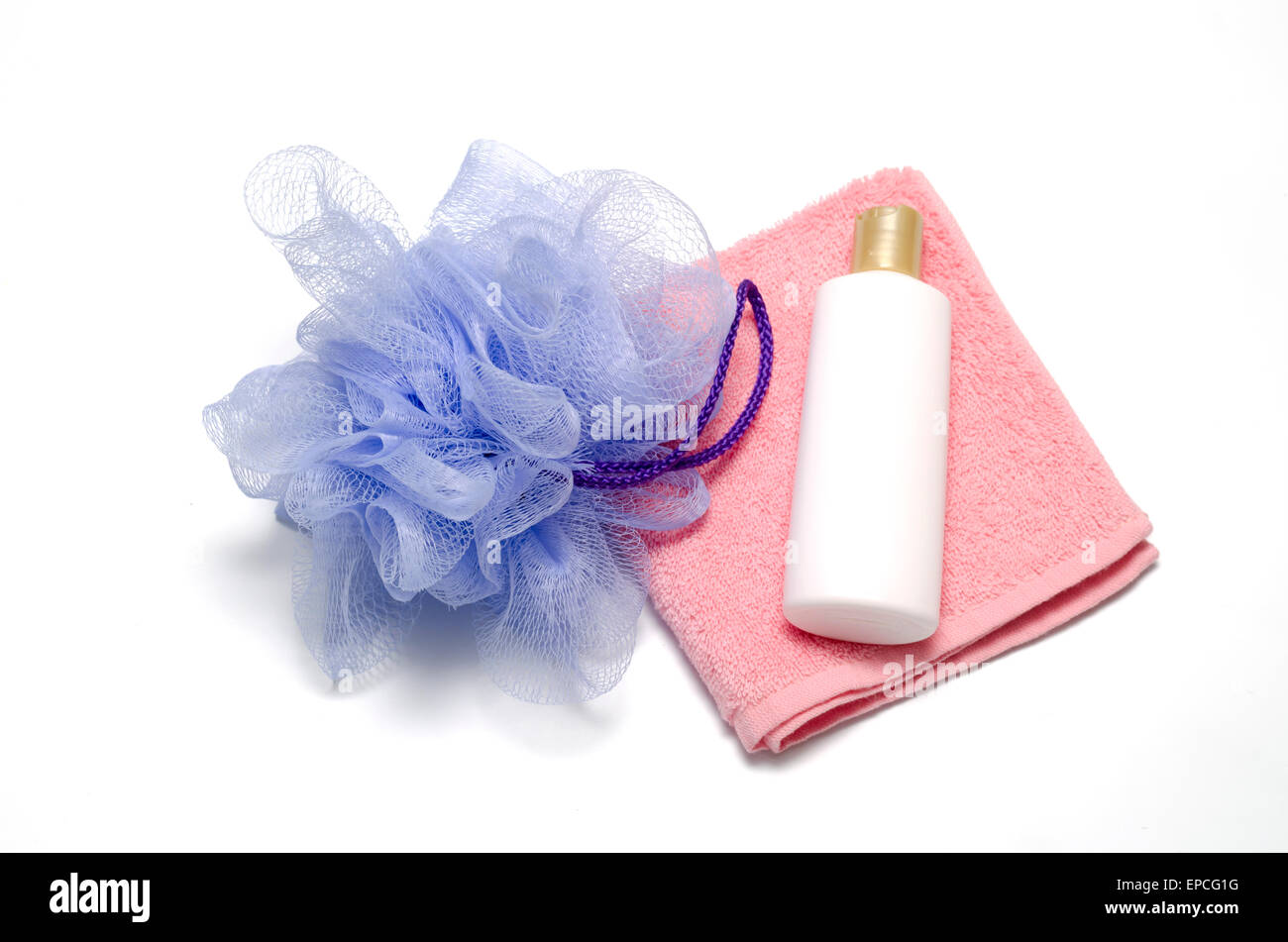 purple bath puff liquid soap and pink towel on a white background Stock ...