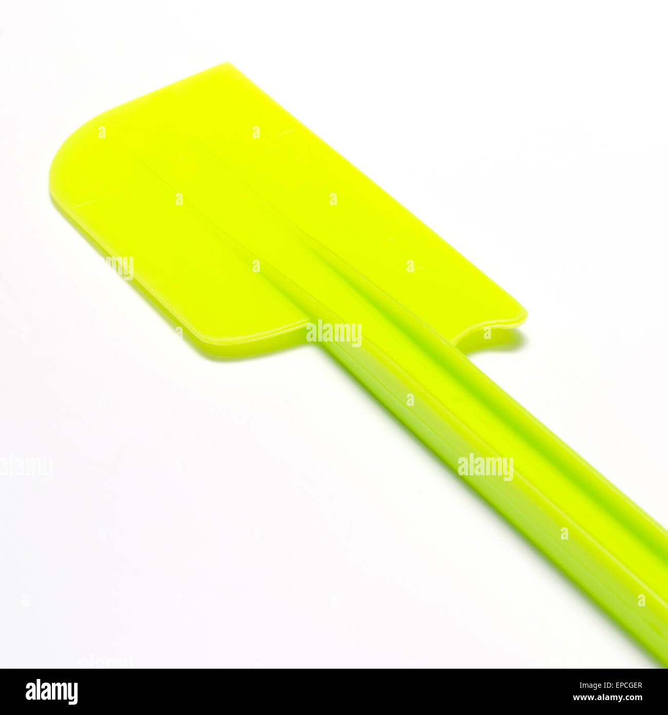 green plastic spatula on a white background Stock Photo - Alamy
