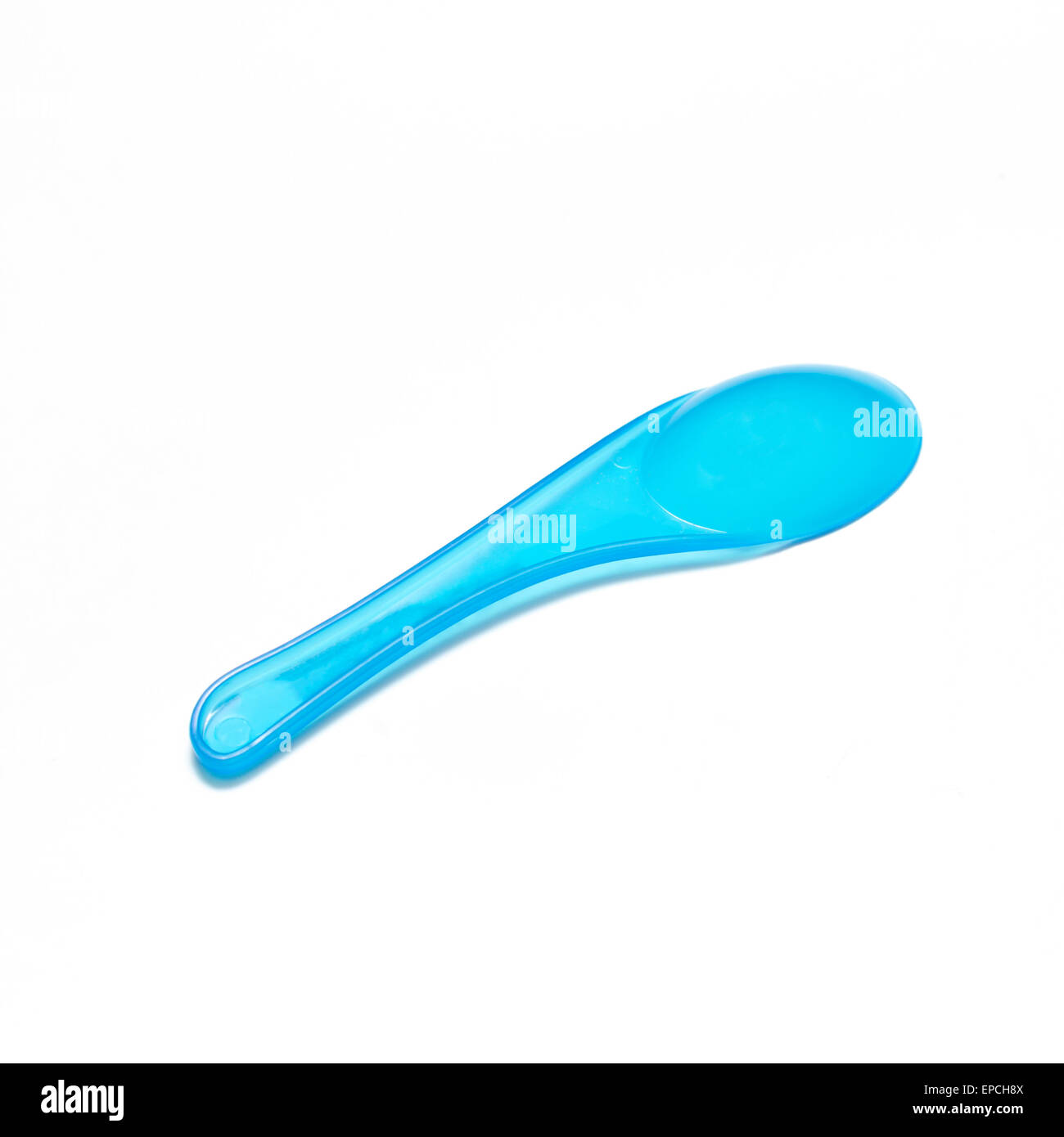 blue plastic spoon on a white background Stock Photo - Alamy