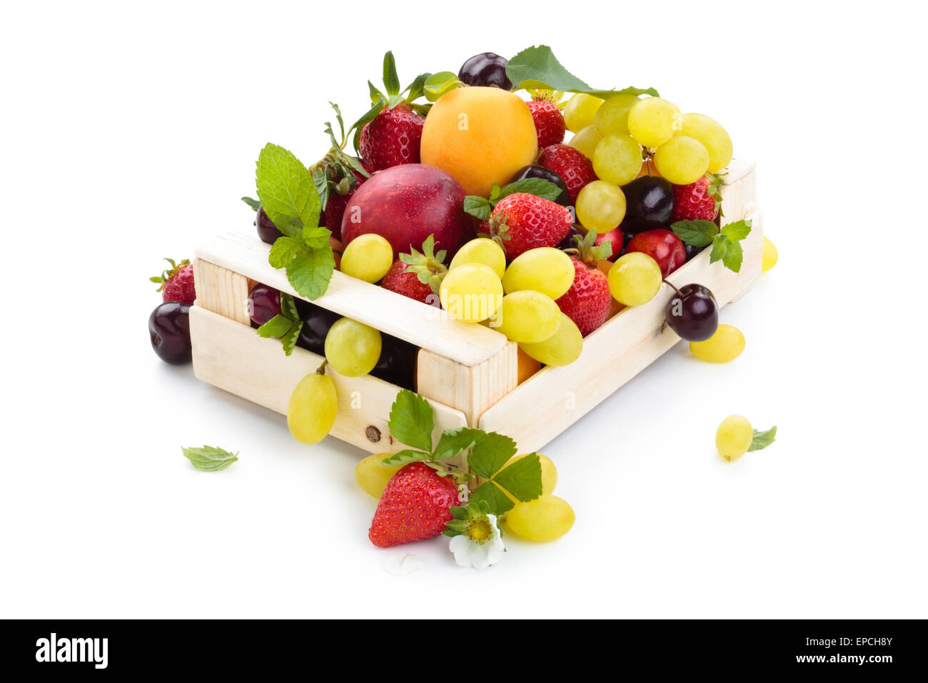 Assorted fruits and mint leaves in box Stock Photo - Alamy