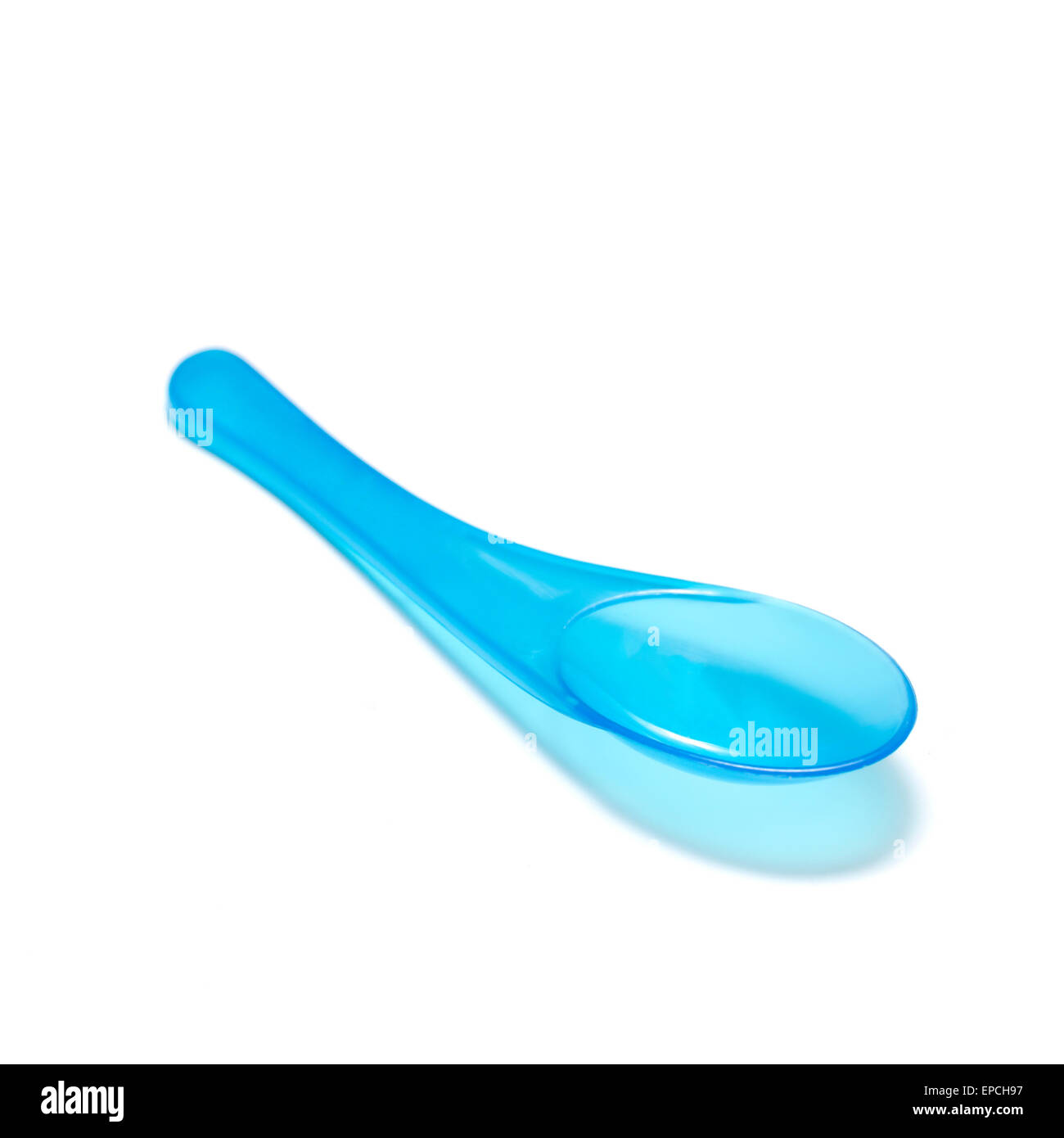 blue plastic spoon on a white background Stock Photo - Alamy