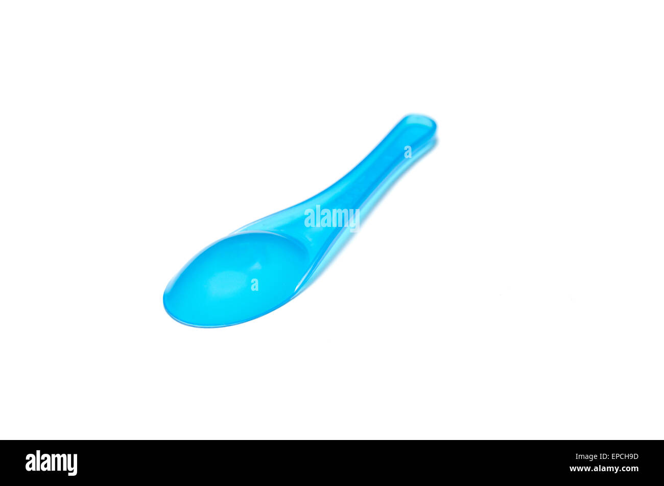 blue plastic spoon on a white background Stock Photo - Alamy