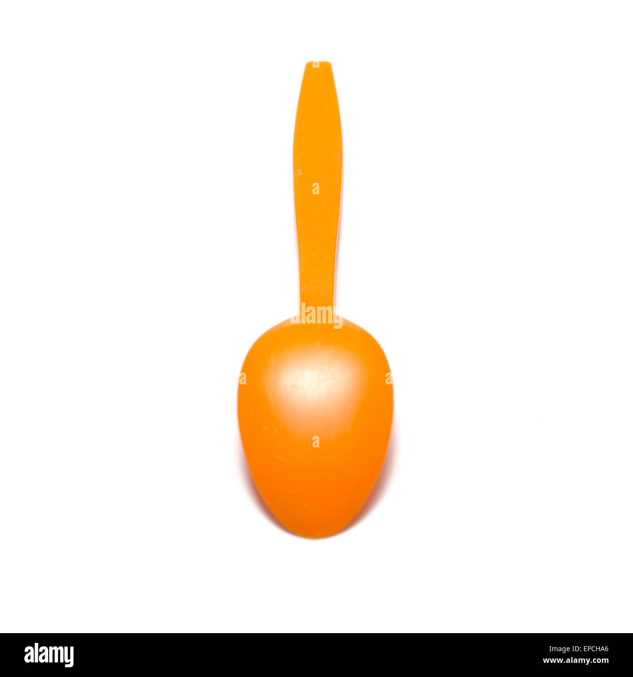 orange plastic spoon on a white background Stock Photo - Alamy