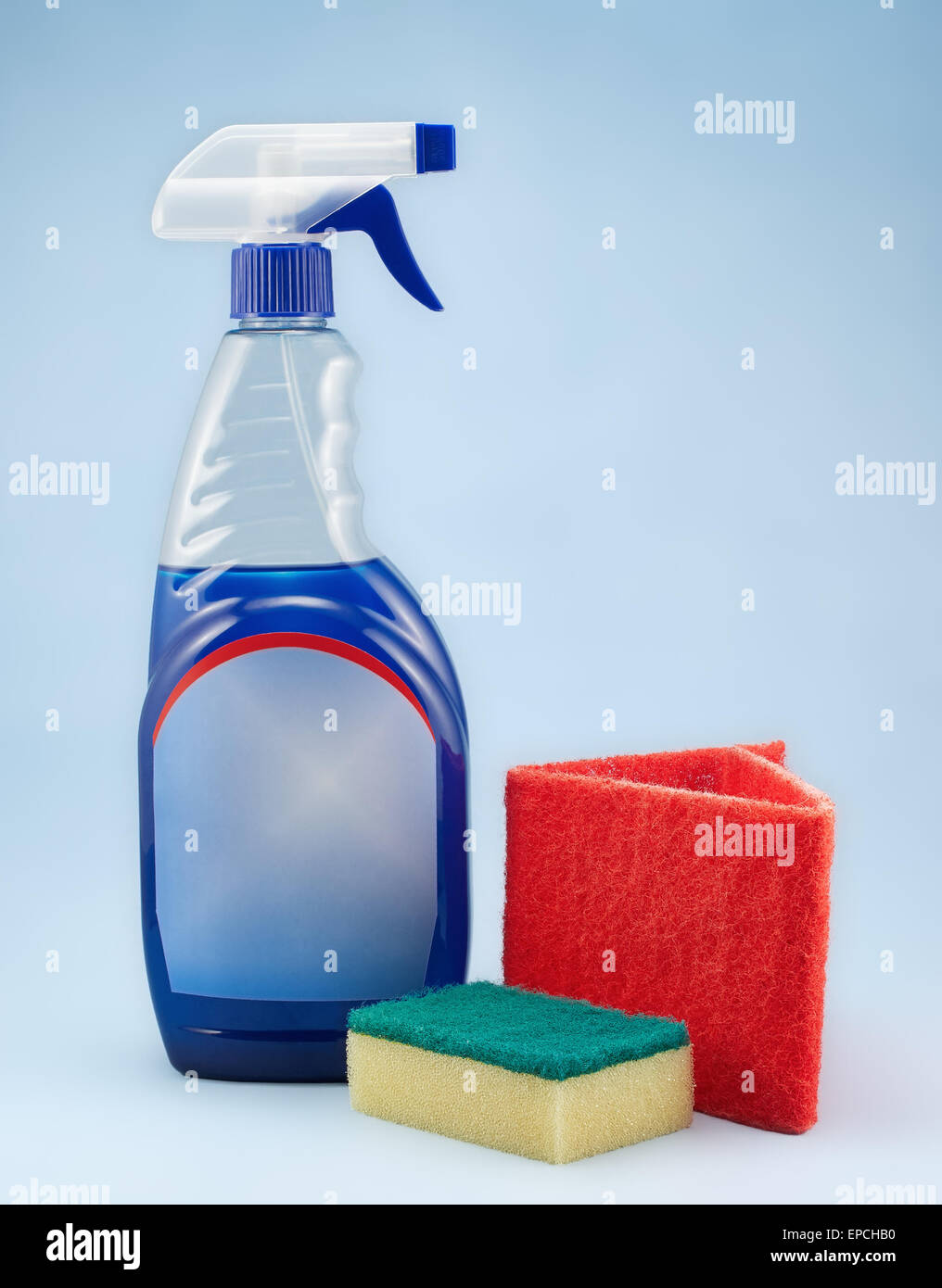 Cleaning blue detergent spray bottle with green and yellow sponge and ...