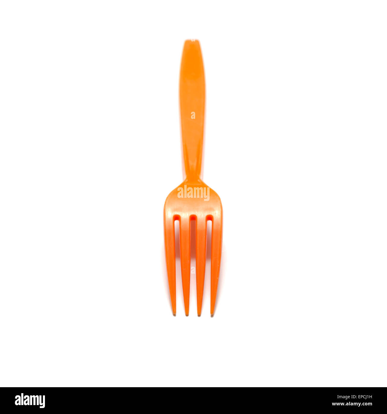 orange plastic fork on a white background Stock Photo - Alamy