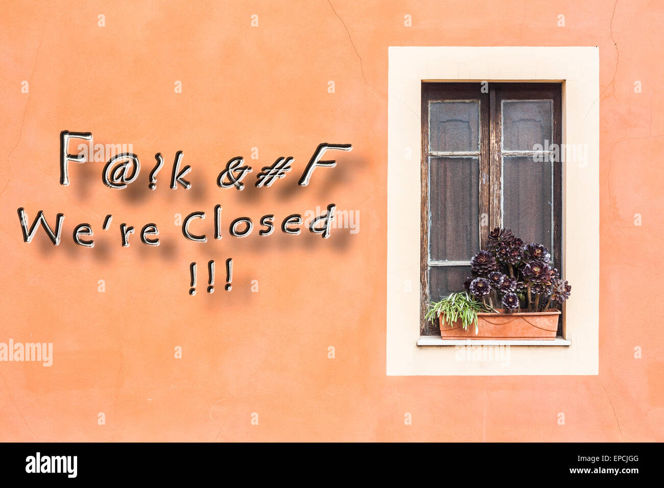 Closed window with planter and orange wall with written Stock Photo - Alamy