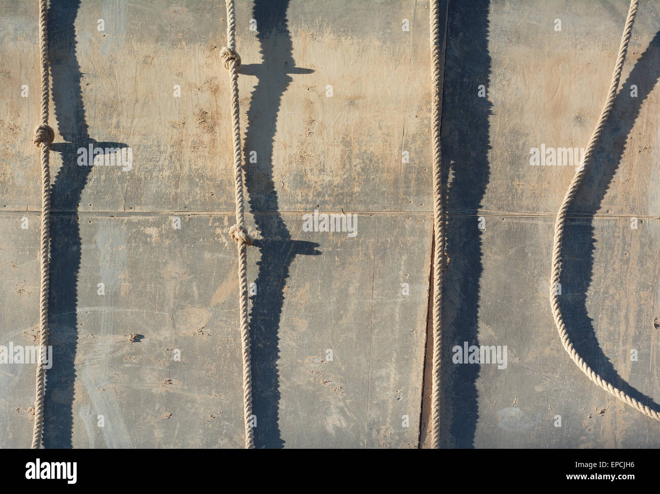 Muddy Rappelling Wall with Rope as Healthy Exercise Stock Photo - Alamy