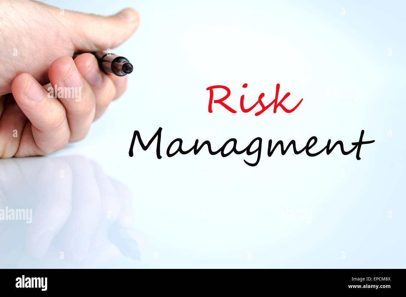 Pen in the hand isolated over white background Risk managment concept ...