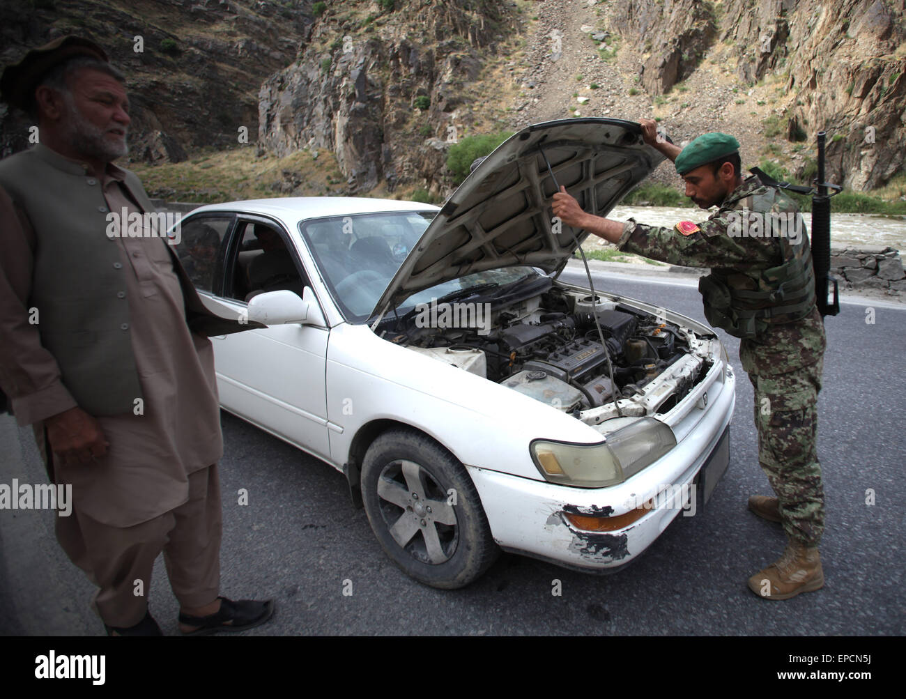 Kabul, Afghanistan. 16th May, 2015. An Afghan army soldier searches a ...