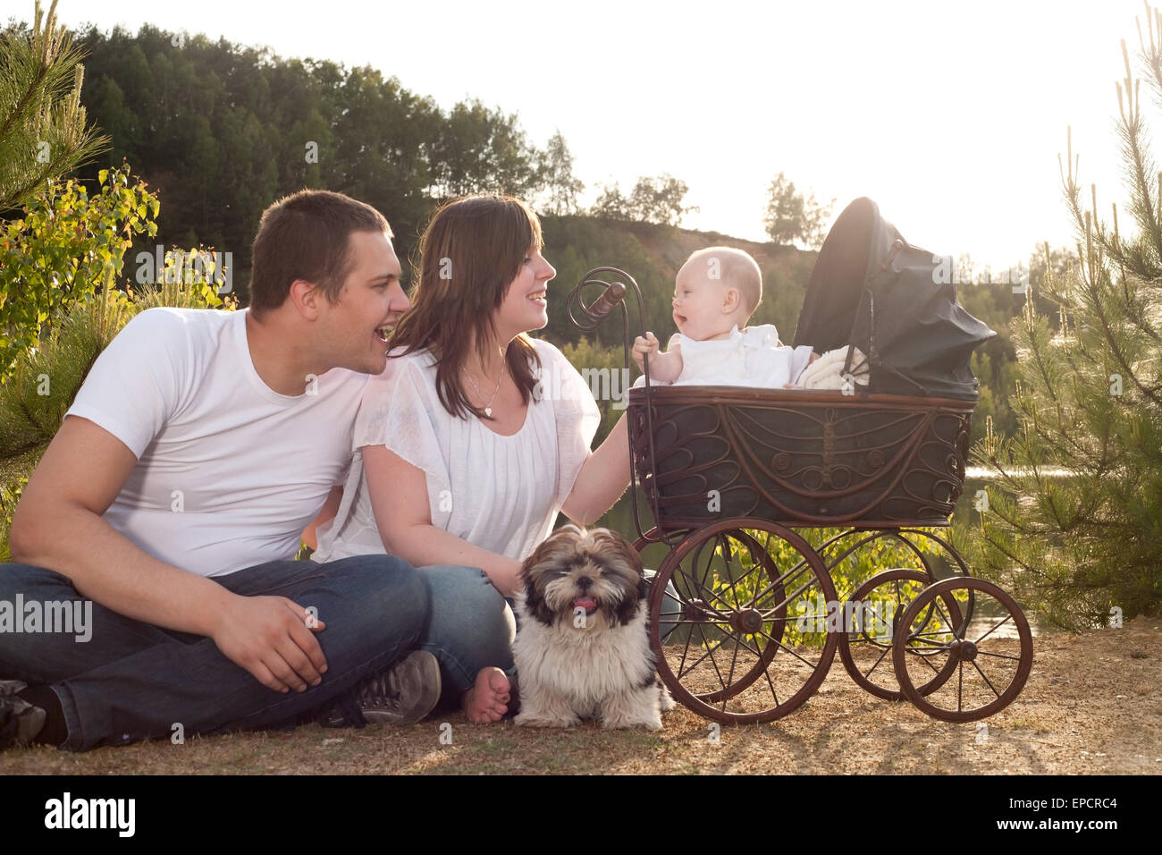 Happy family with baby outside hi-res stock photography and images - Alamy