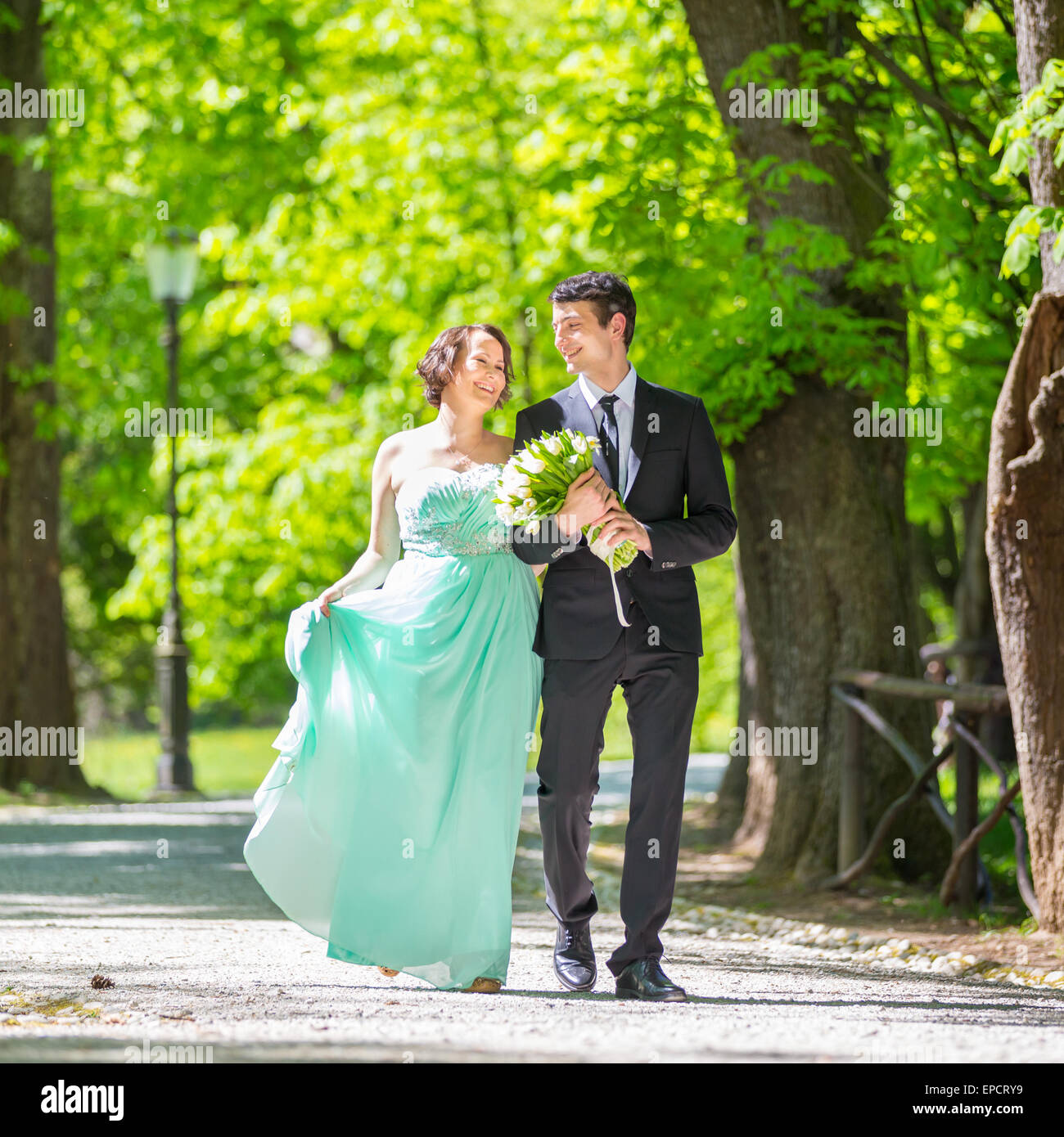 Beautiful wedding couple in park hi-res stock photography and images ...