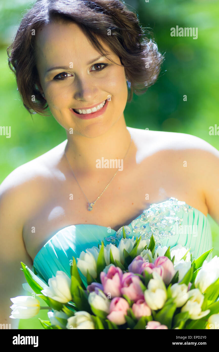 Bride holding bouquet smiling hi-res stock photography and images - Alamy