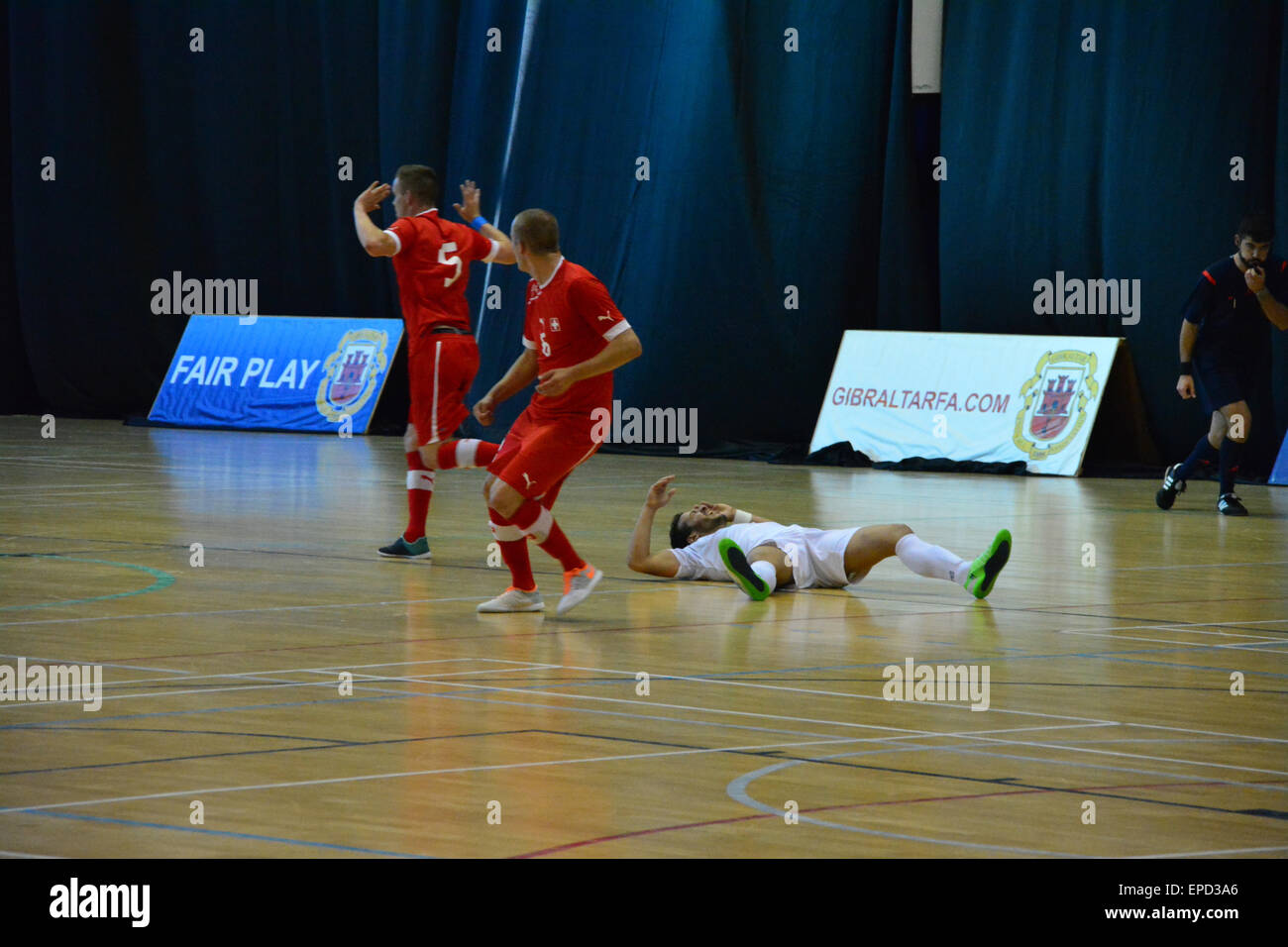 Gibraltar. 16th May, 2015. A Gibraltar player hits the ground hard as ...