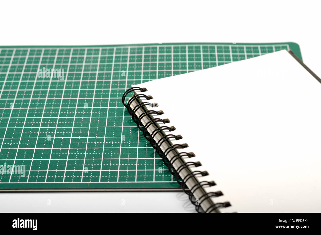 notebook and cutting mat on a white background Stock Photo - Alamy