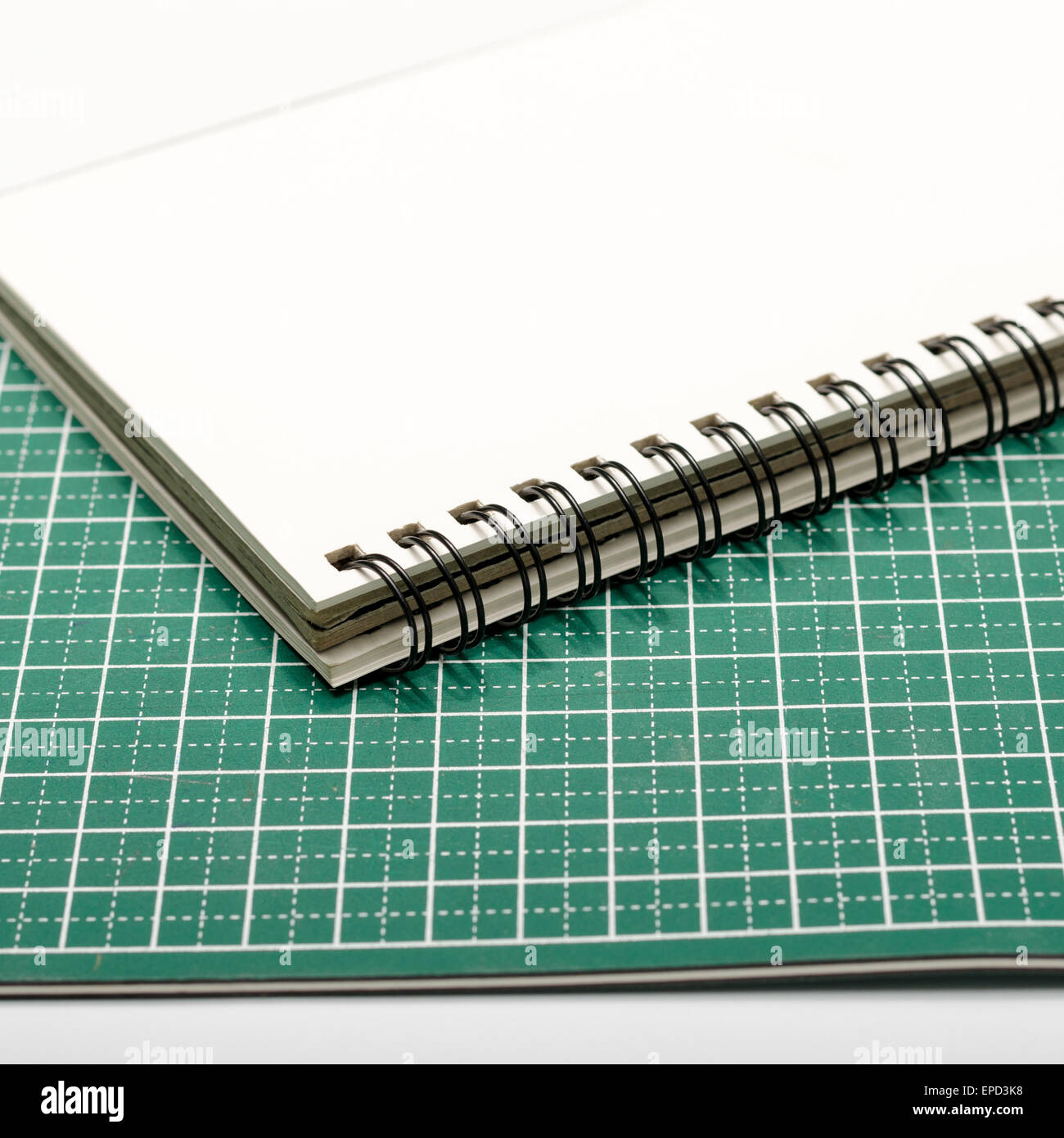 notebook and cutting mat on a white background Stock Photo - Alamy