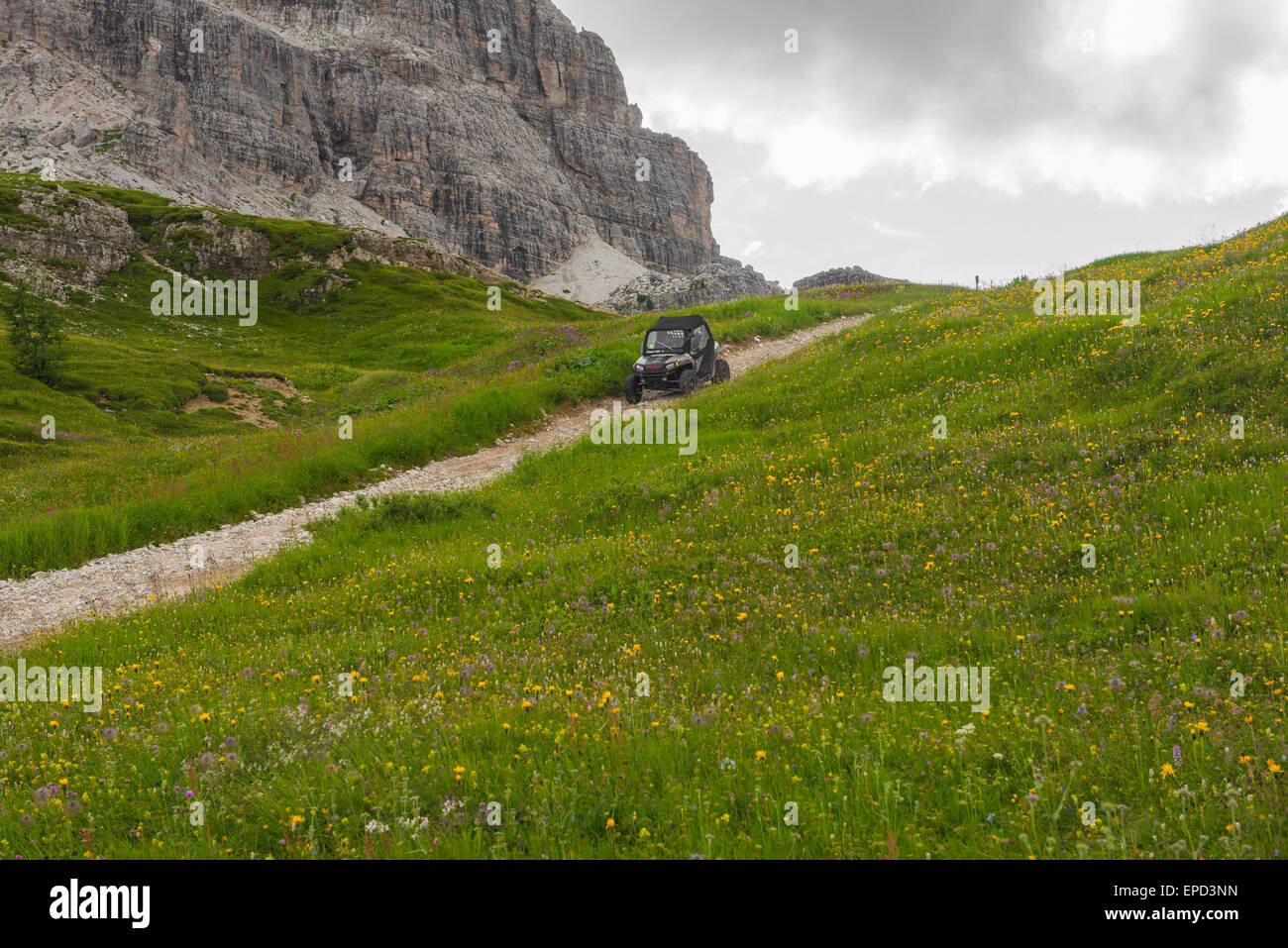Dune buggy on a path on Dolomites, Italy Stock Photo - Alamy