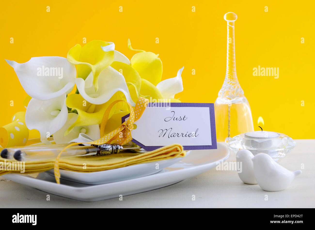Yellow and white theme wedding table place setting with heart shape ...