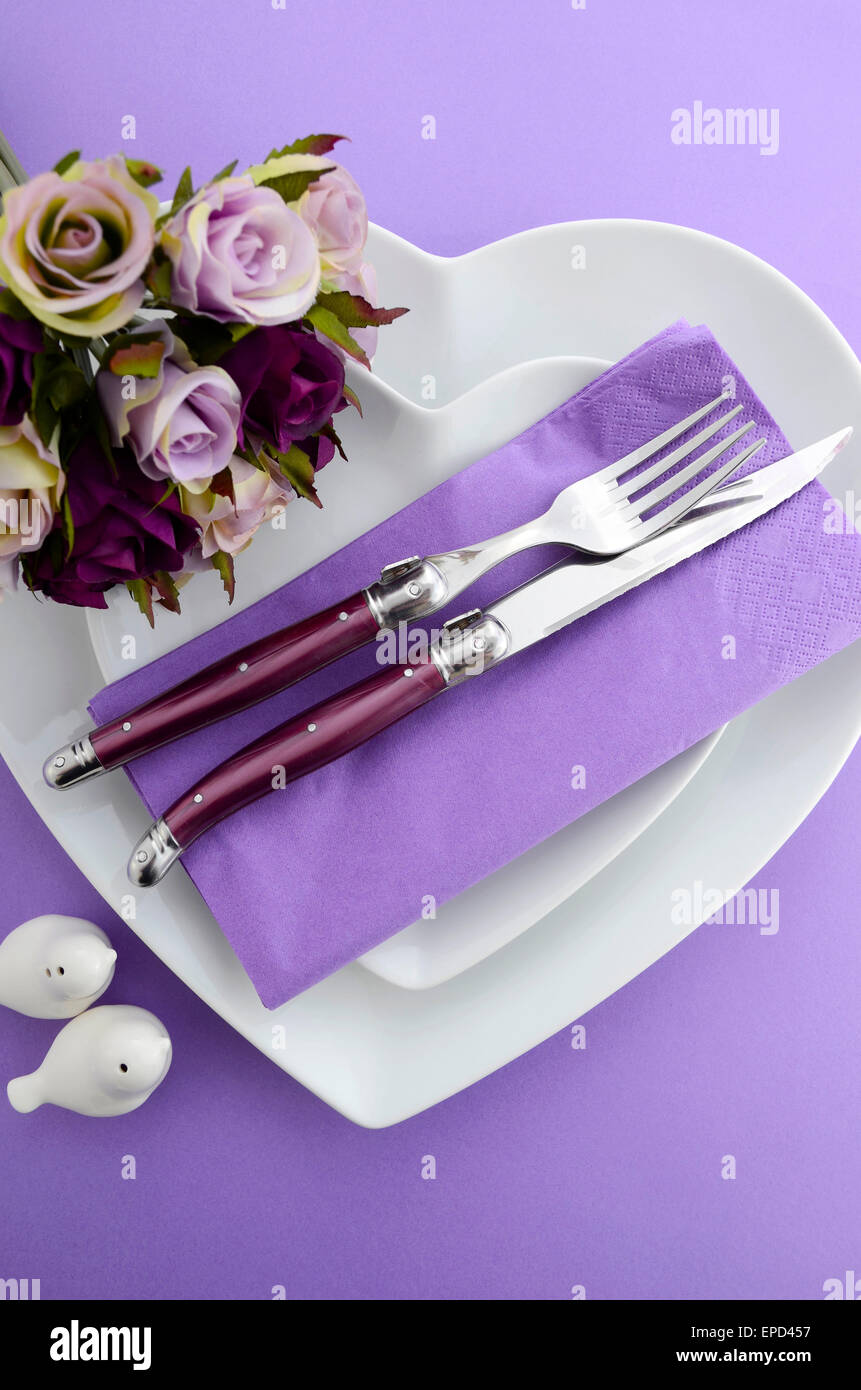 Purple theme wedding table place setting with heart shape plates and ...