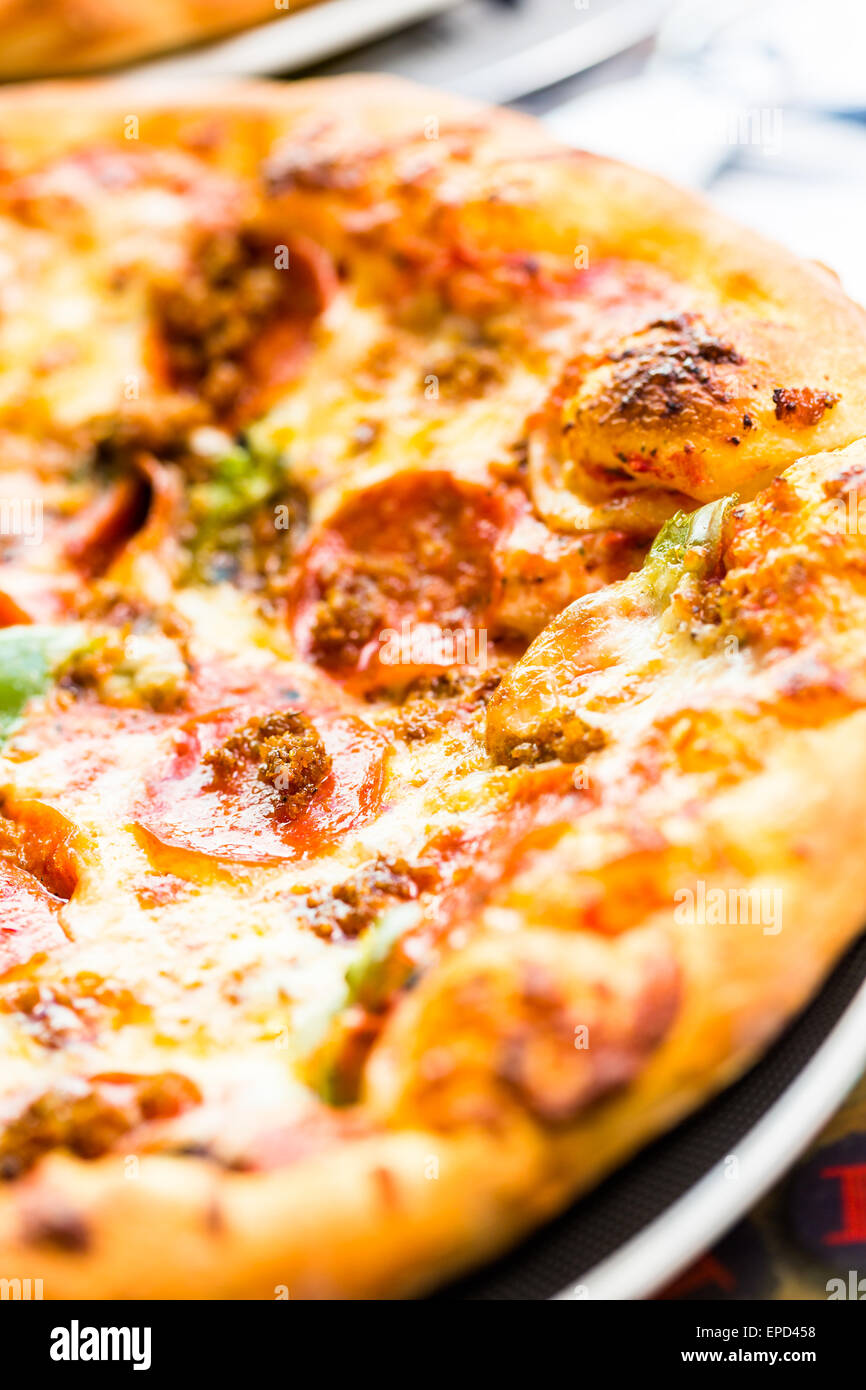 Fresh combo pizza in Italian restaurant Stock Photo - Alamy