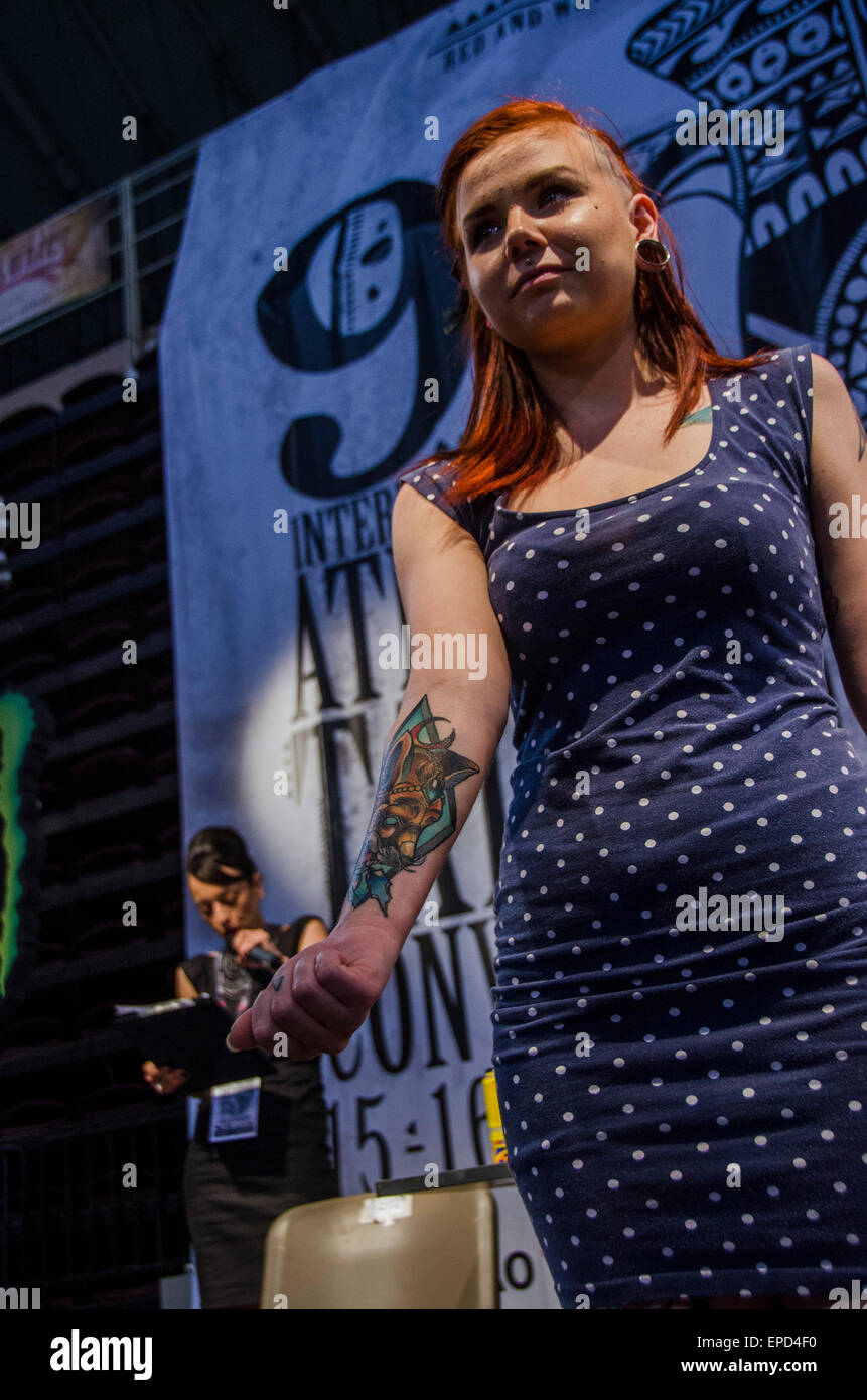 Athens, Greece. 16th May, 2015. A woman shows the tattoo on her arm ...