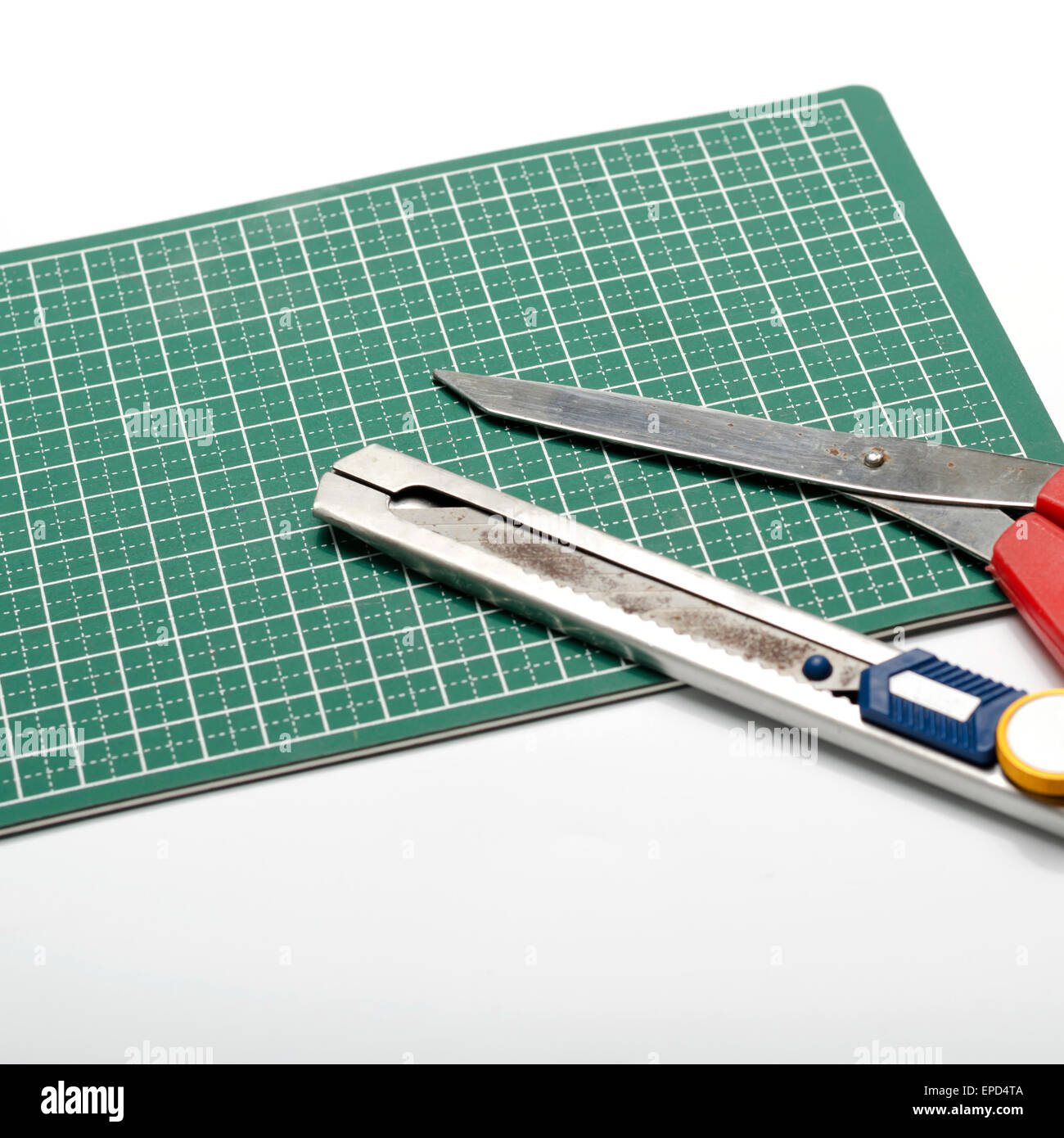 tools on green cutting mat Stock Photo - Alamy