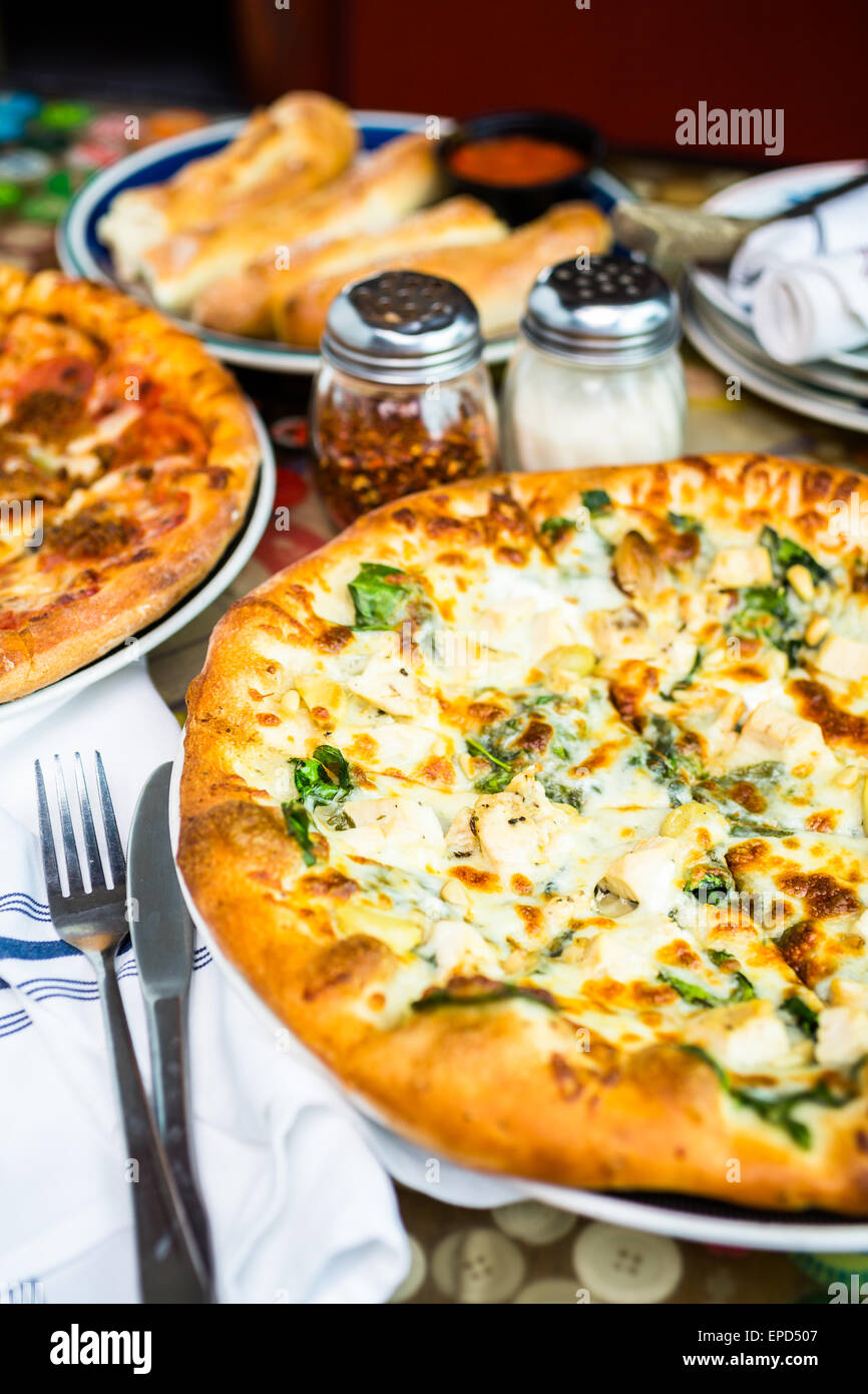 Fresh chicken pine nut pizza in Italian restaurant Stock Photo - Alamy
