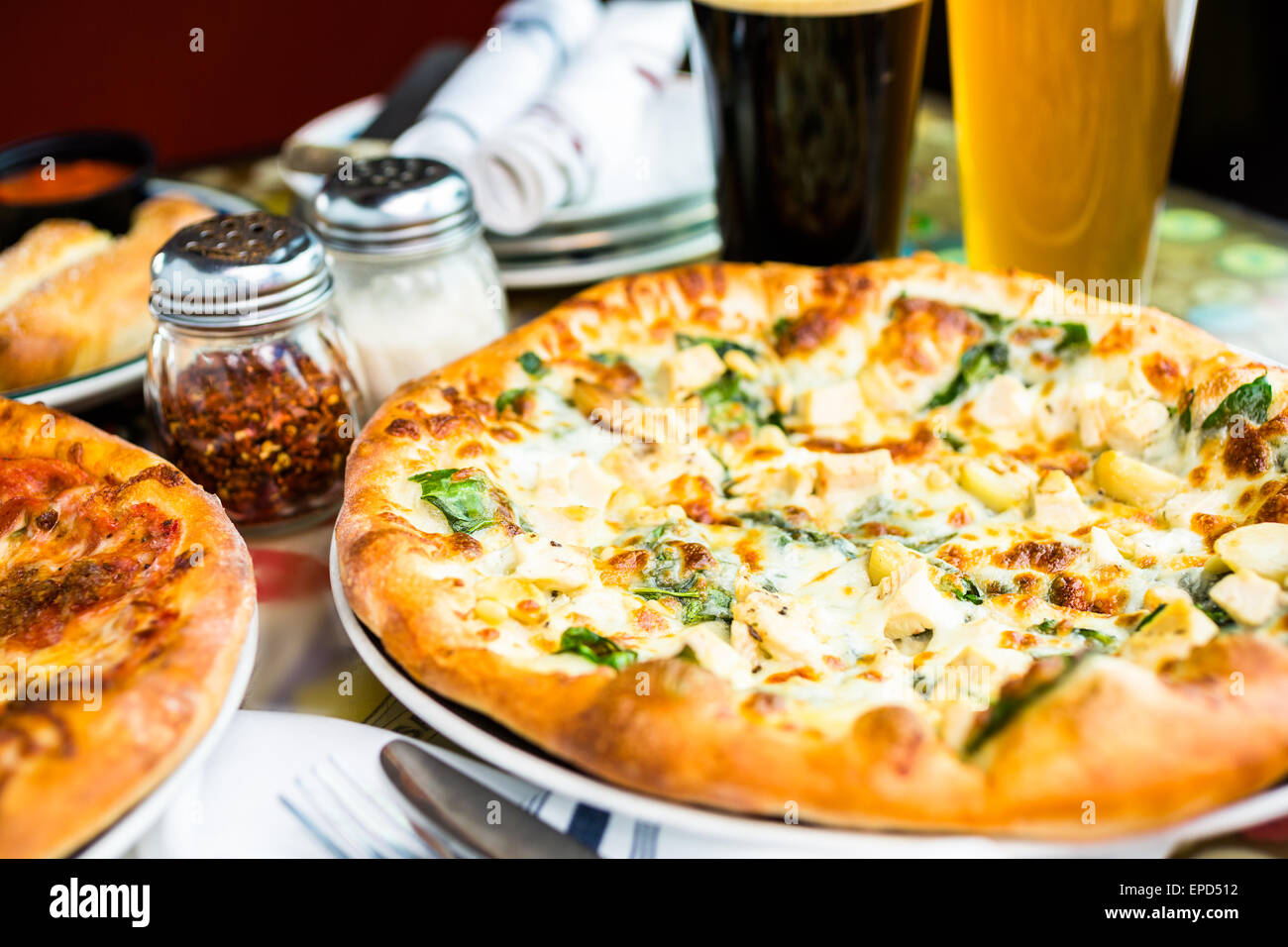 Fresh chicken pine nut pizza in Italian restaurant Stock Photo - Alamy