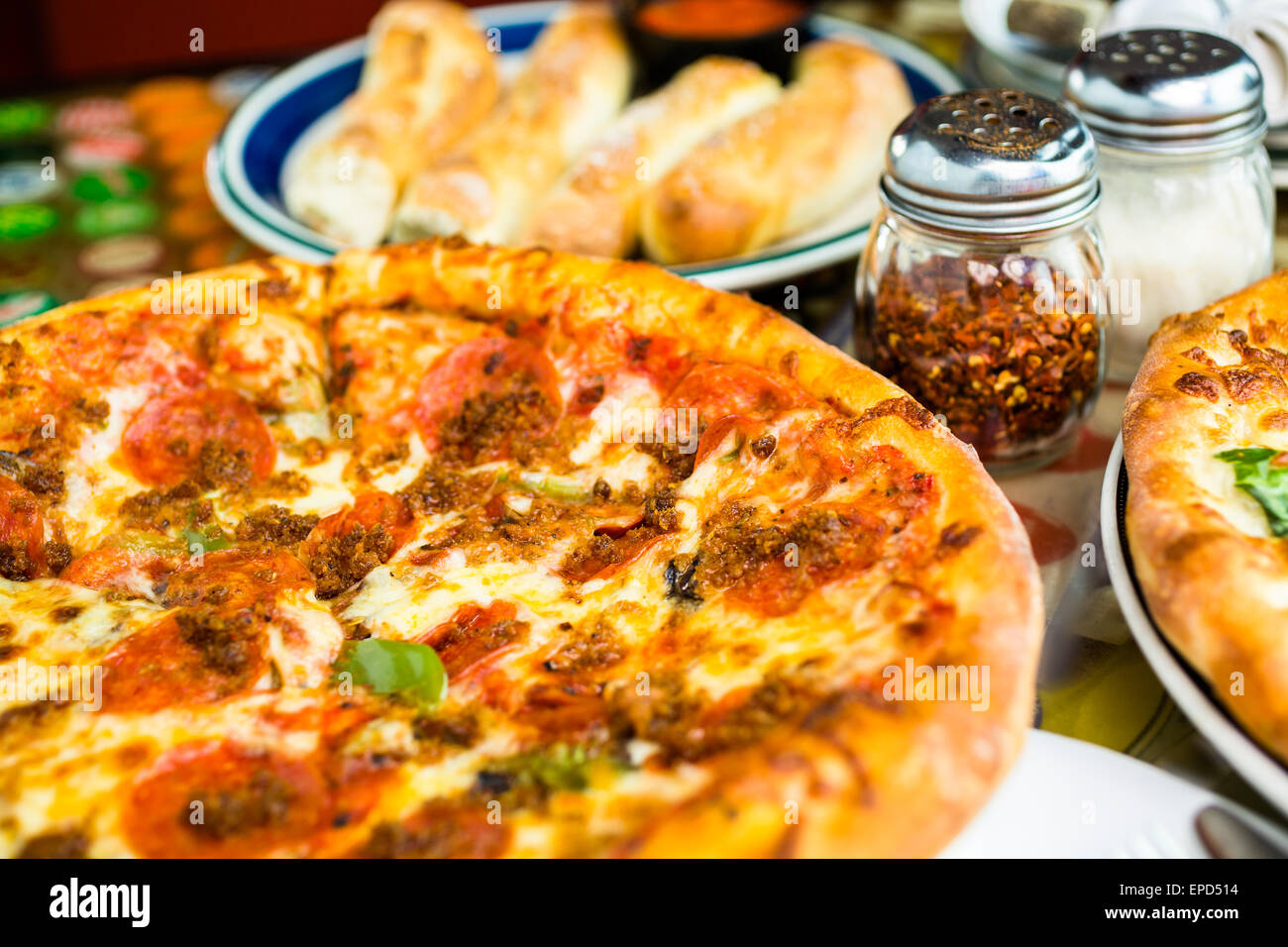 Fresh combo pizza in Italian restaurant Stock Photo - Alamy