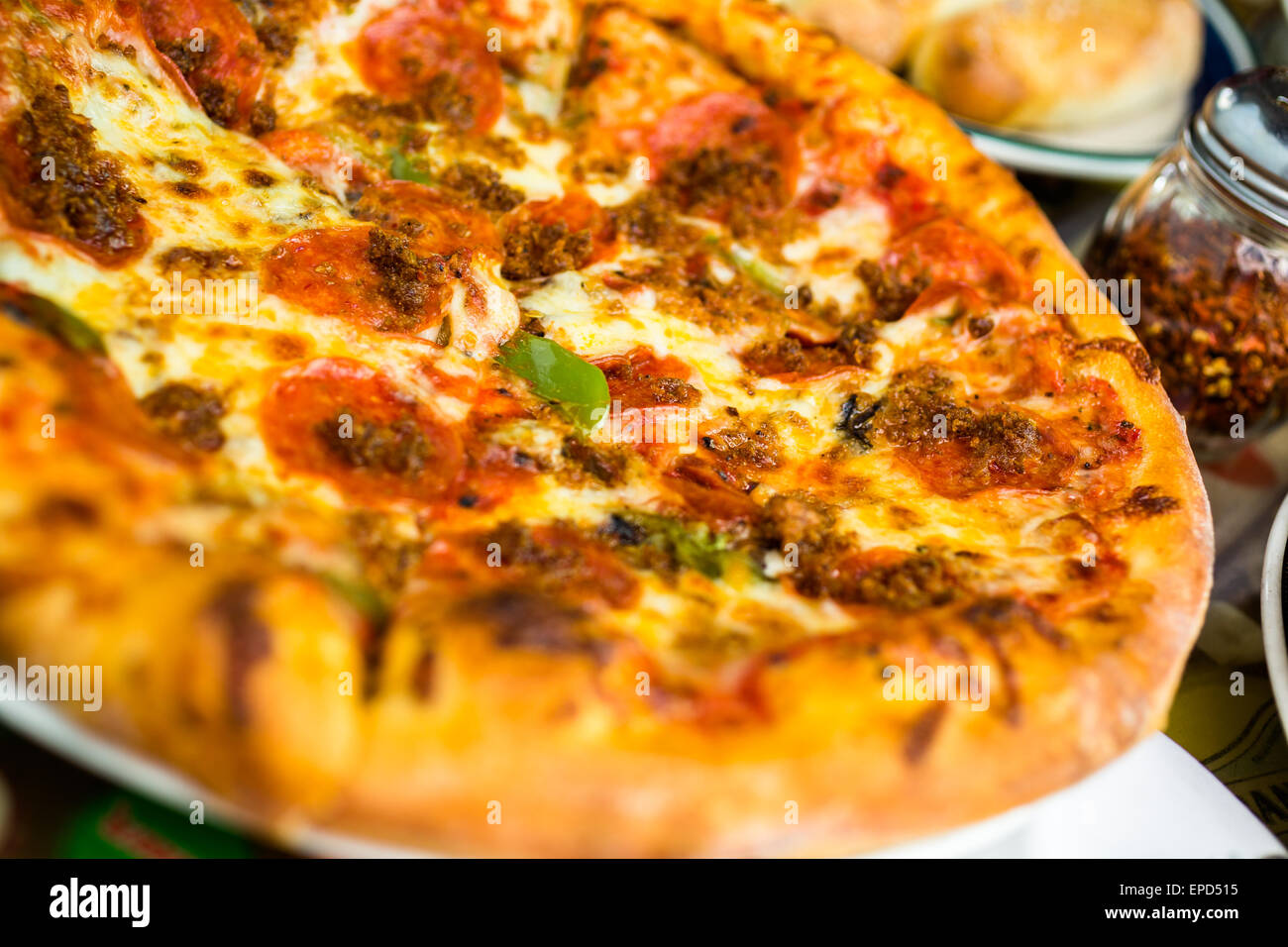 Fresh combo pizza in Italian restaurant Stock Photo - Alamy