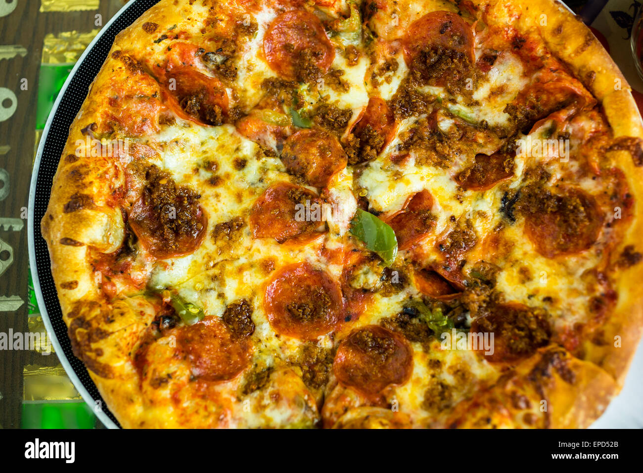Fresh combo pizza in Italian restaurant Stock Photo - Alamy